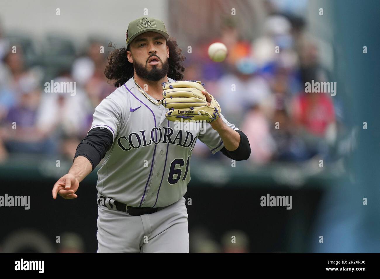 Colorado Rockies relief pitcher Justin Lawrence (61) tosses the ...
