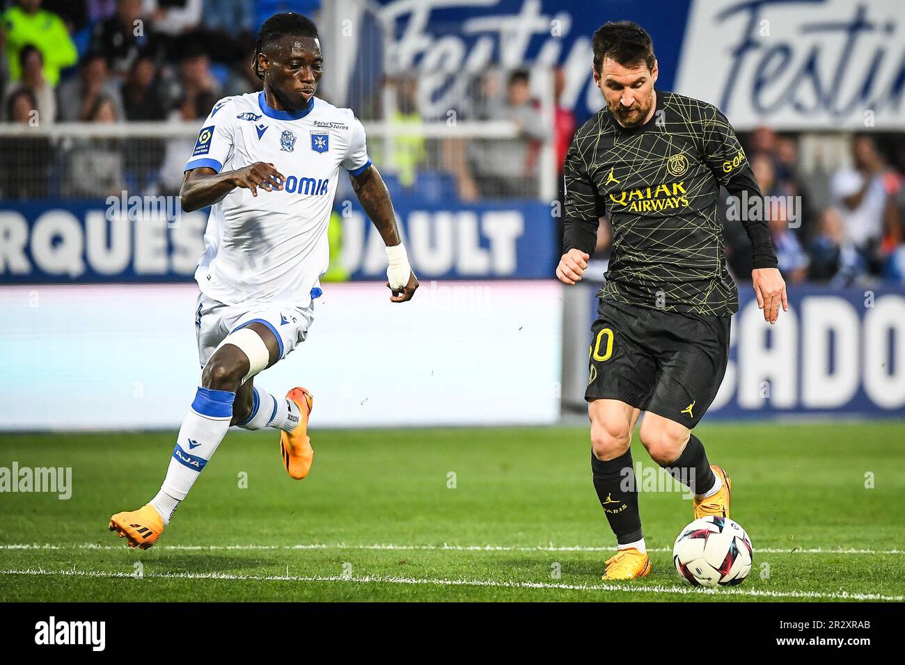 Gideon MENSAH of Auxerre and Lionel (Leo) MESSI of PSG during the ...