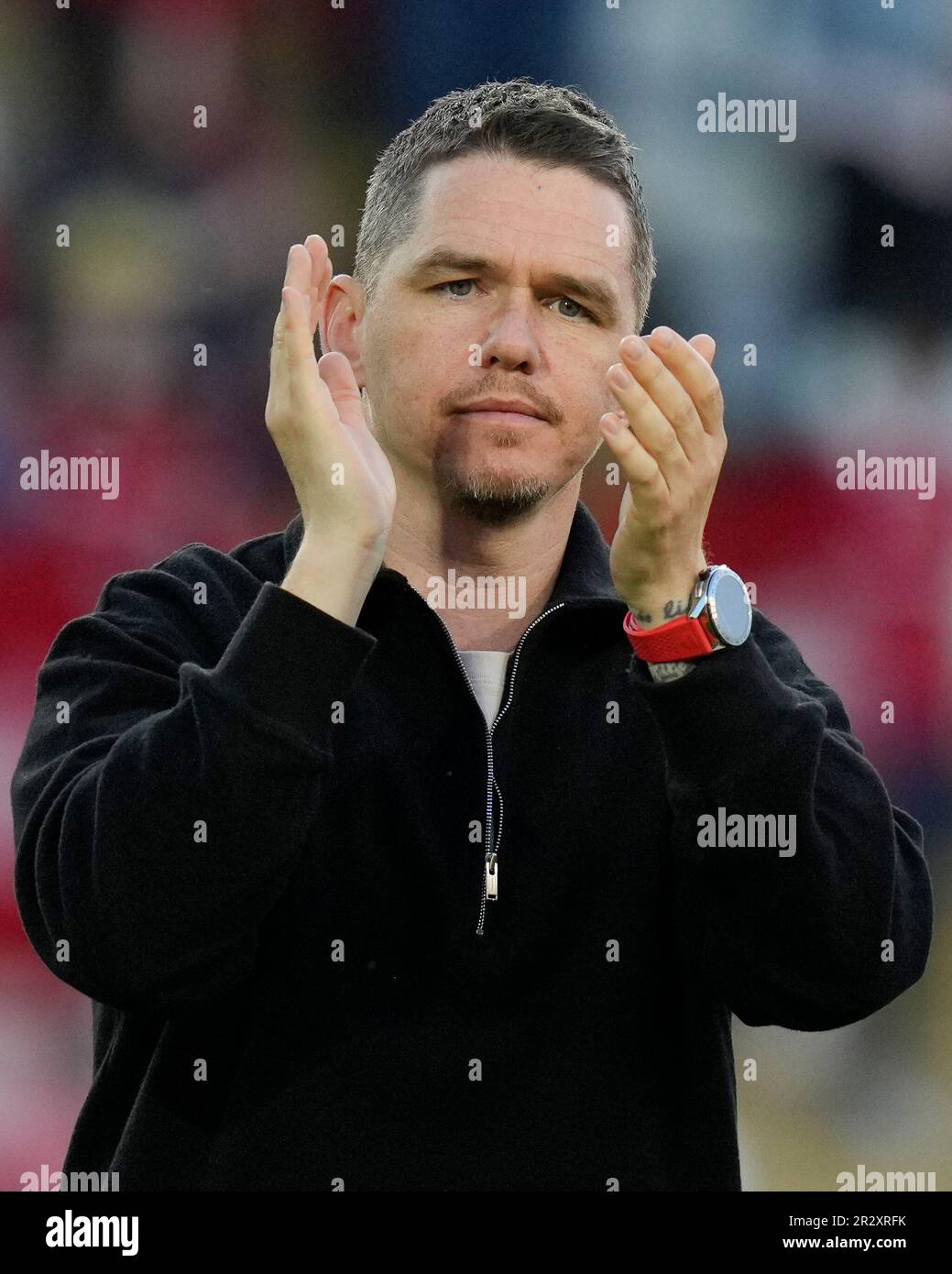 Marc Skinner the Manchester United Women's manager salutes the fans ...