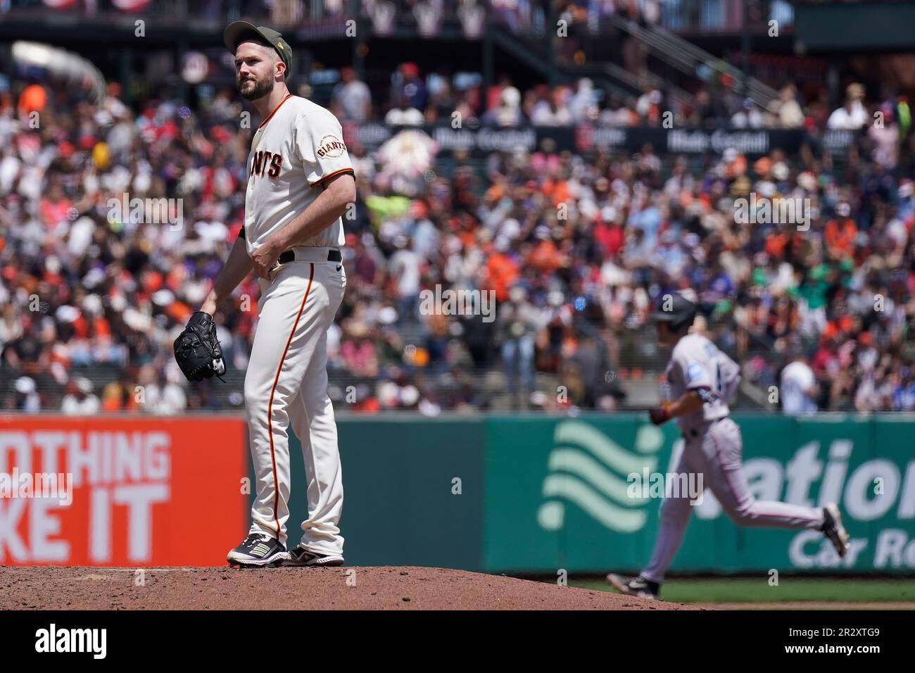 San Francisco Giants pitcher Alex Wood, left, reacts after Miami ...