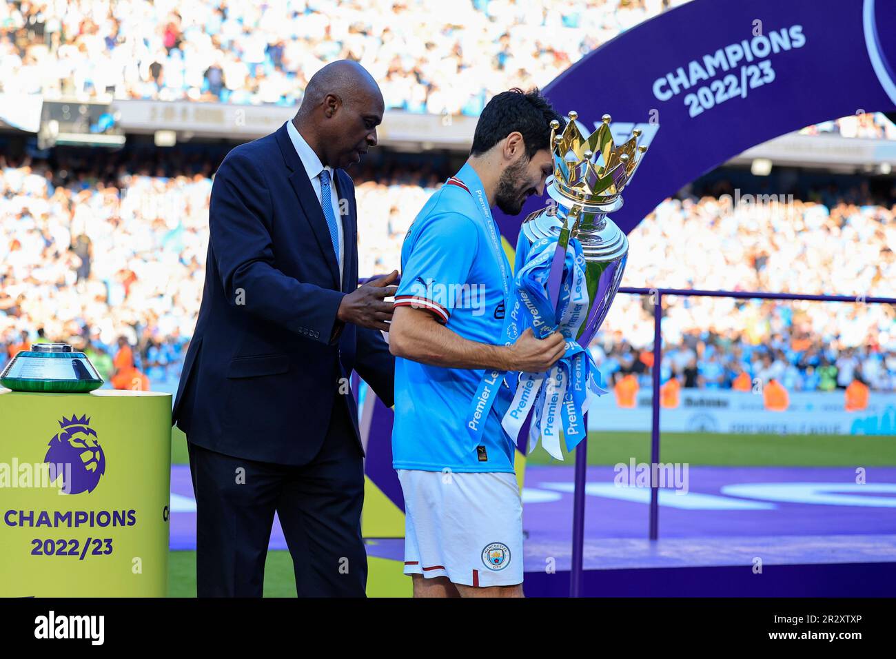 Ilkay Gundogan #8 of Manchester City takes the Premier League trophy ...