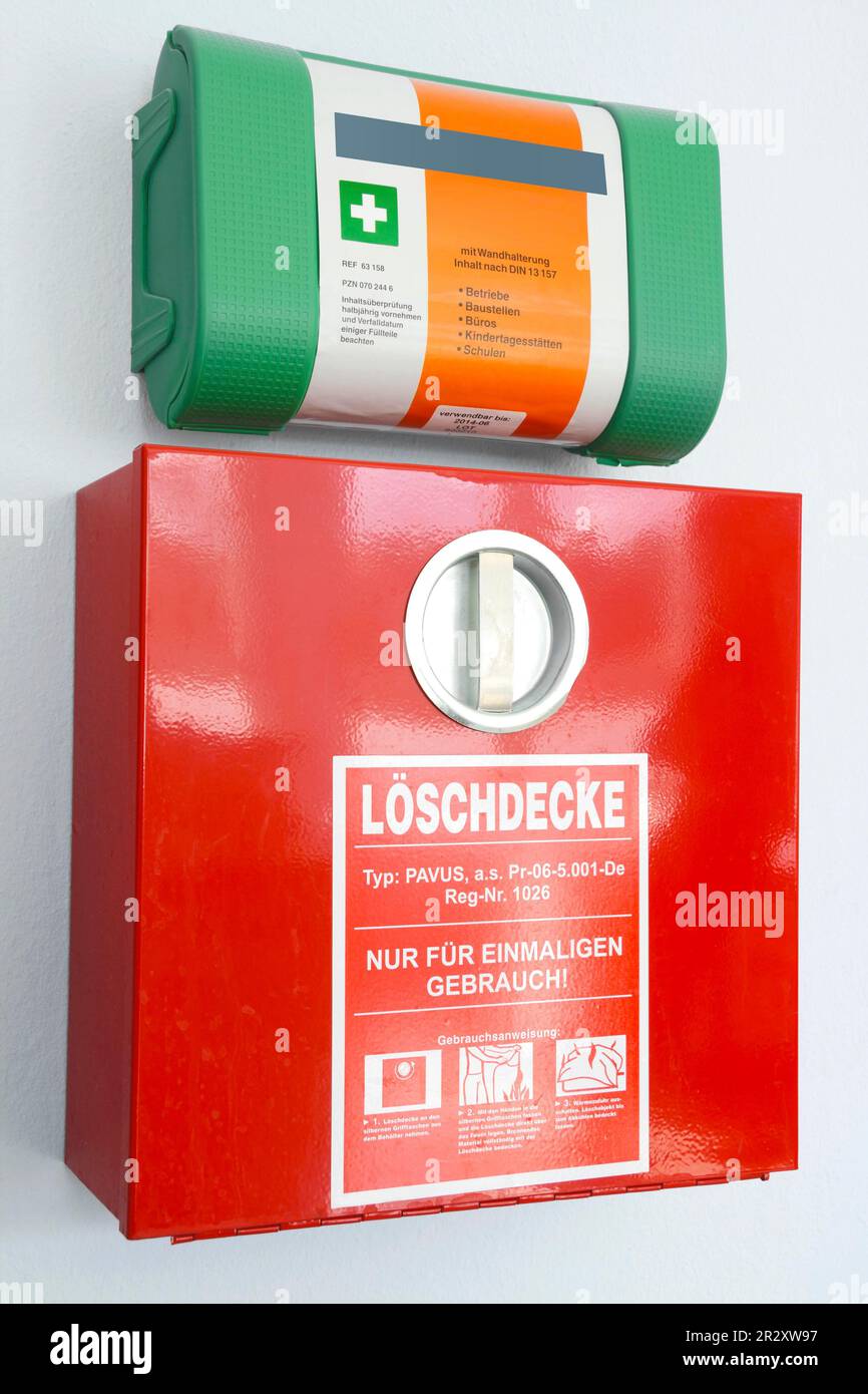 First aid kit and fire protection blanket with the German inscription ...