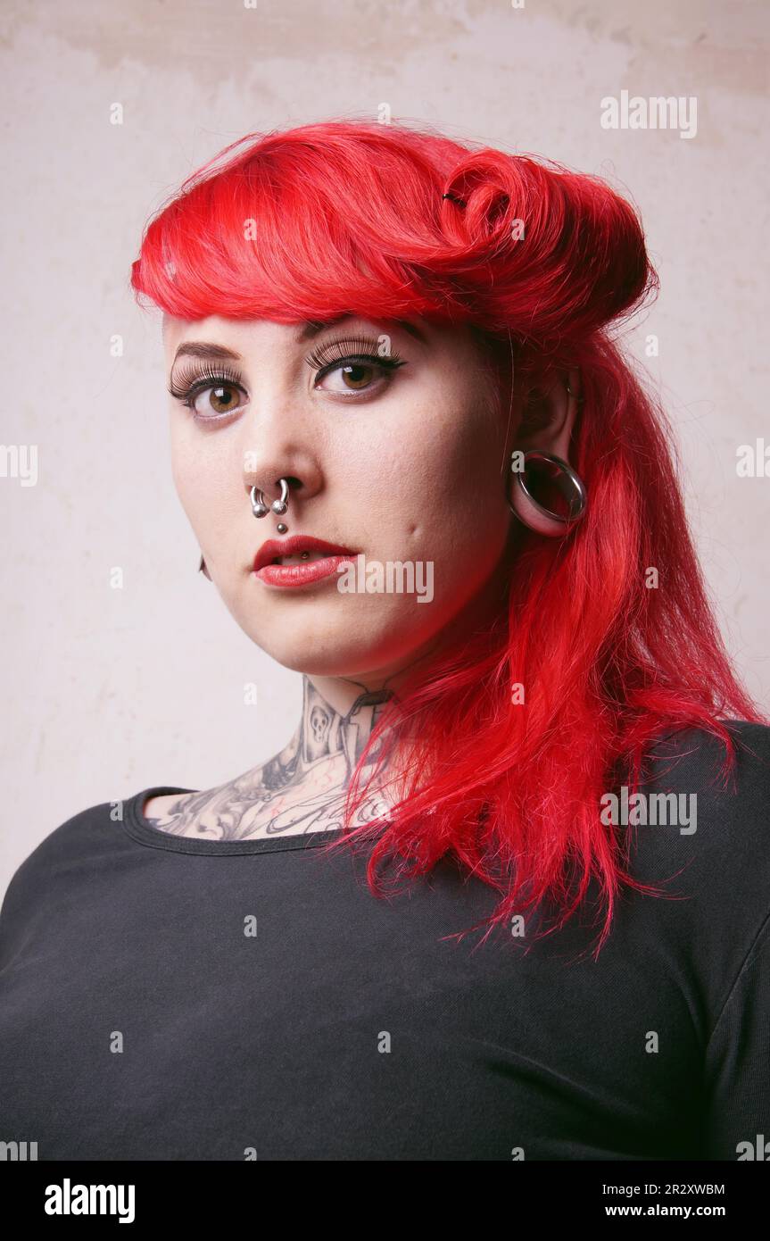 young alternative woman with facial piercings and tattoos Stock Photo ...