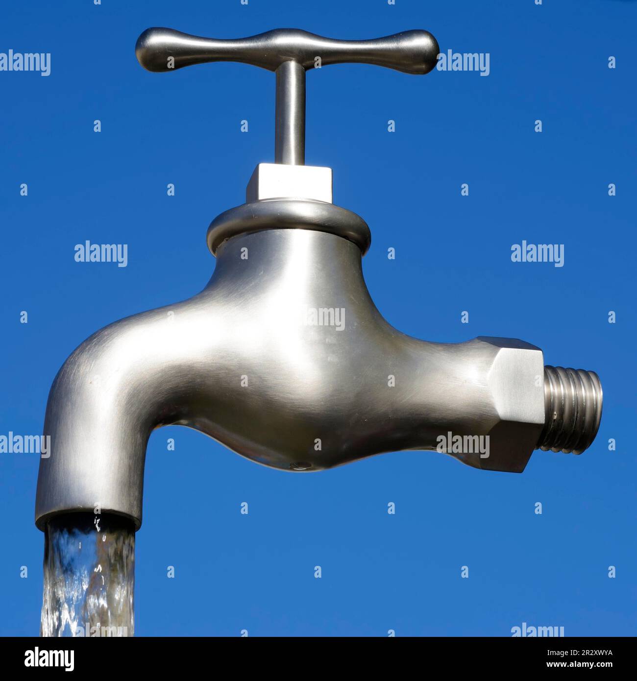 Illusion with a magic faucet and flowing water Stock Photo - Alamy