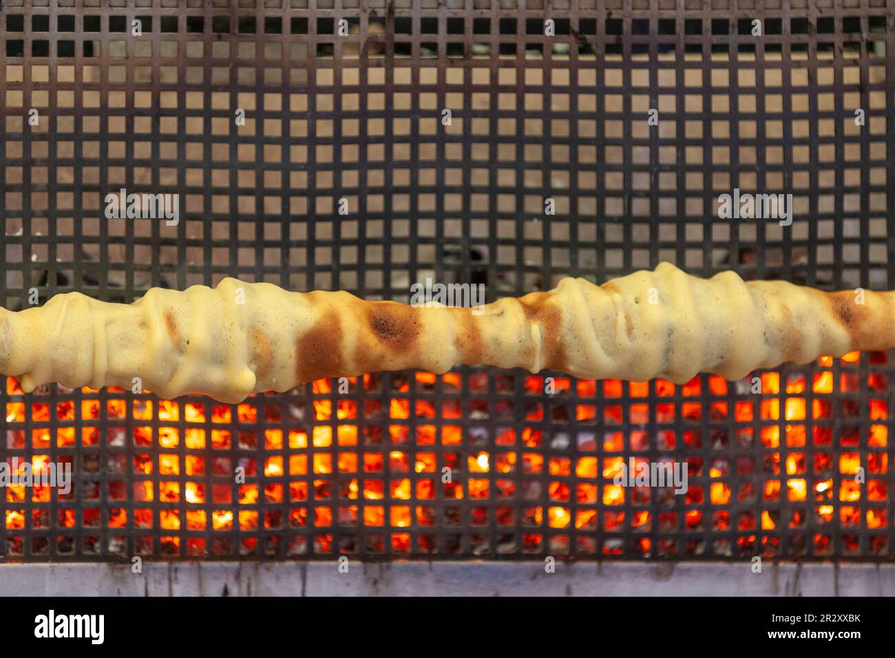 A French spit cake consisting of layers of batter placed, one at a time ...