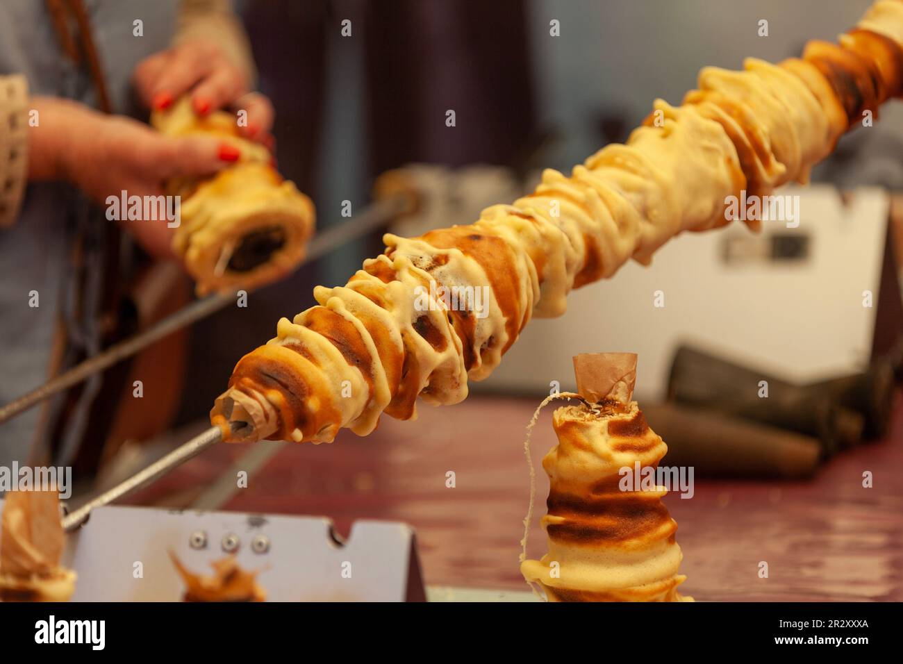 A French spit cake made with layers of batter deposited, one at a time ...