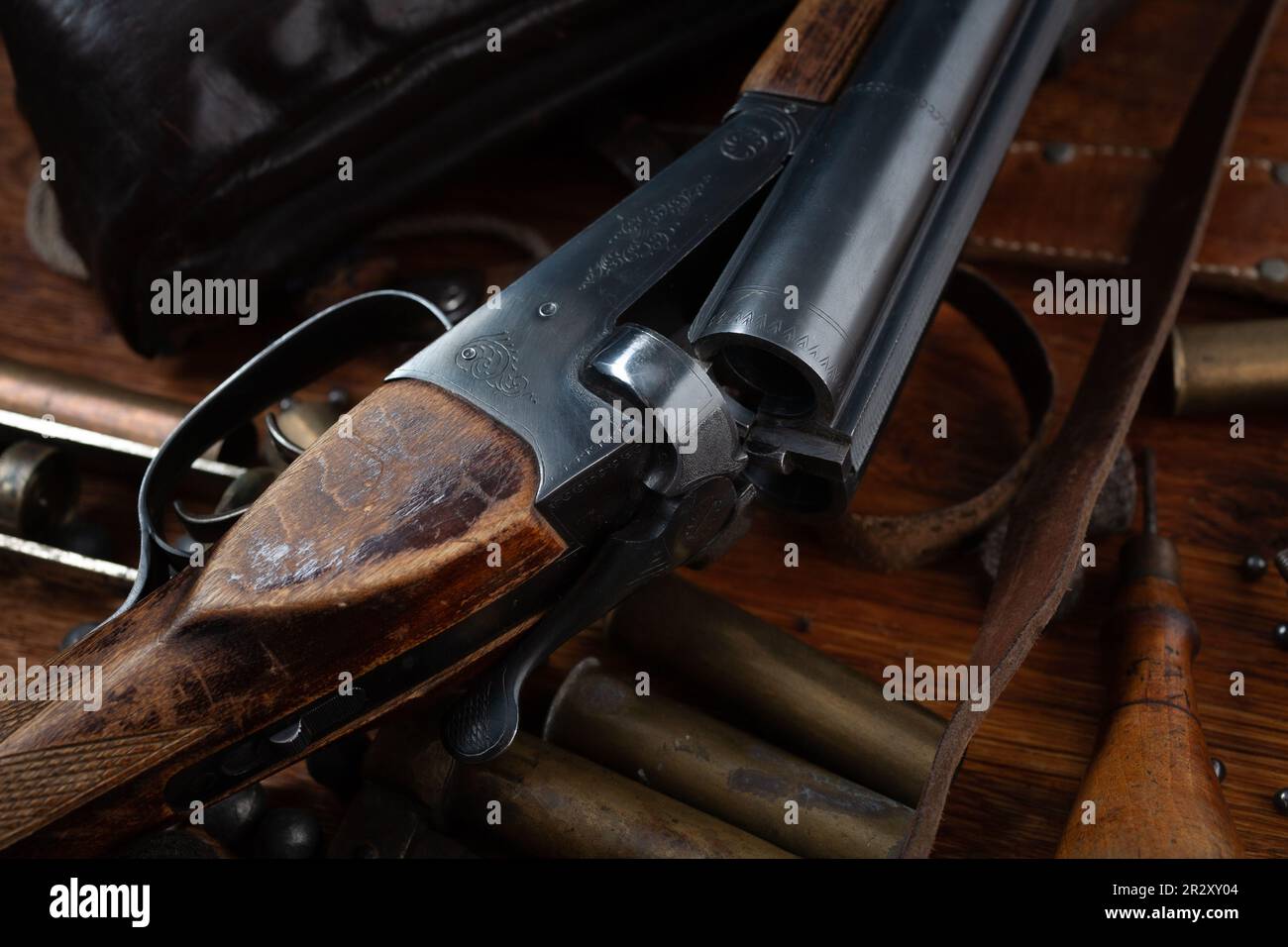 Antique 16-gauge break-action smooth-bored shotgun with brass cases and ...