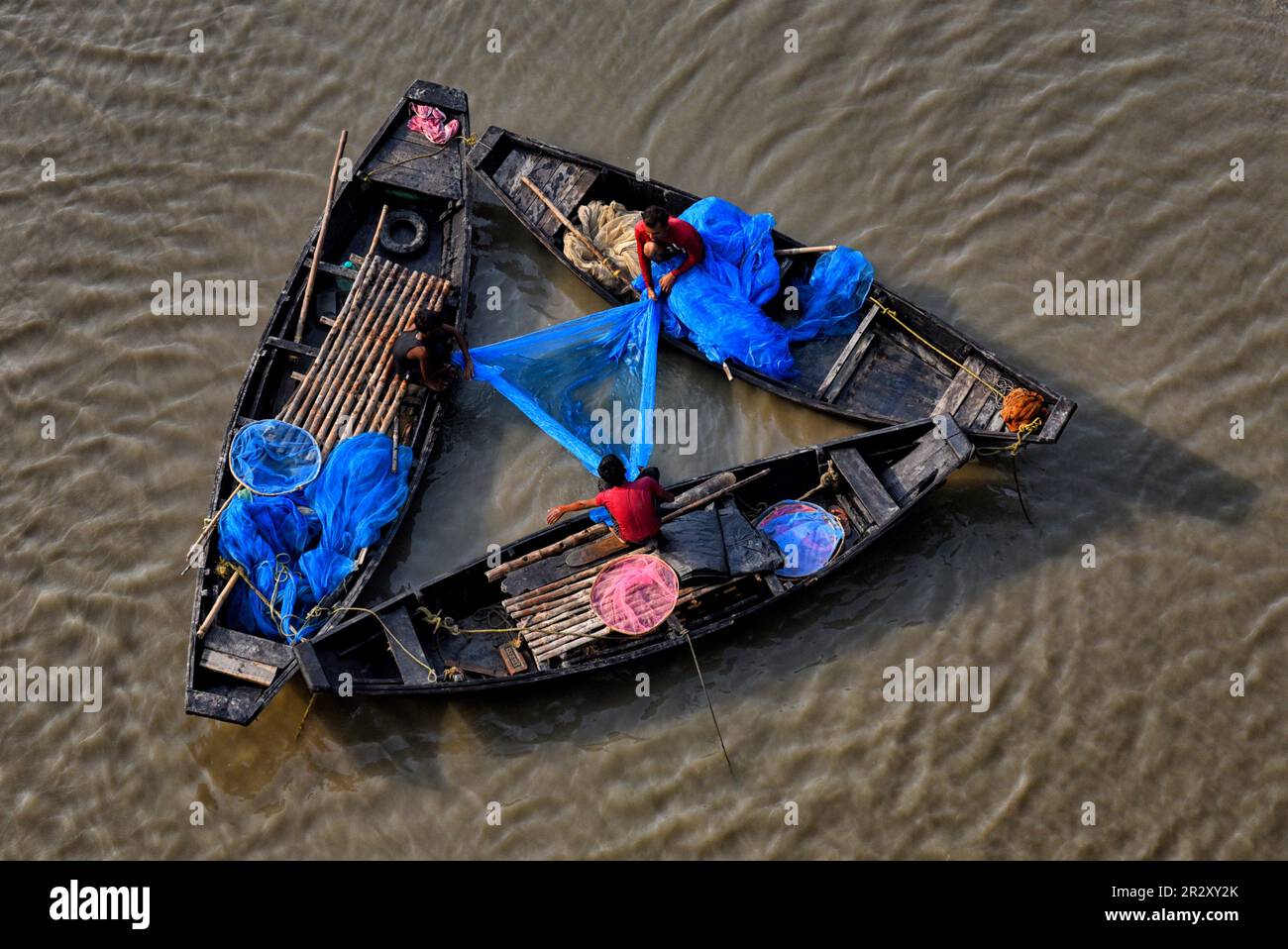 Canning, India. 21st May, 2023. Fishermen seen using colourful nets ...
