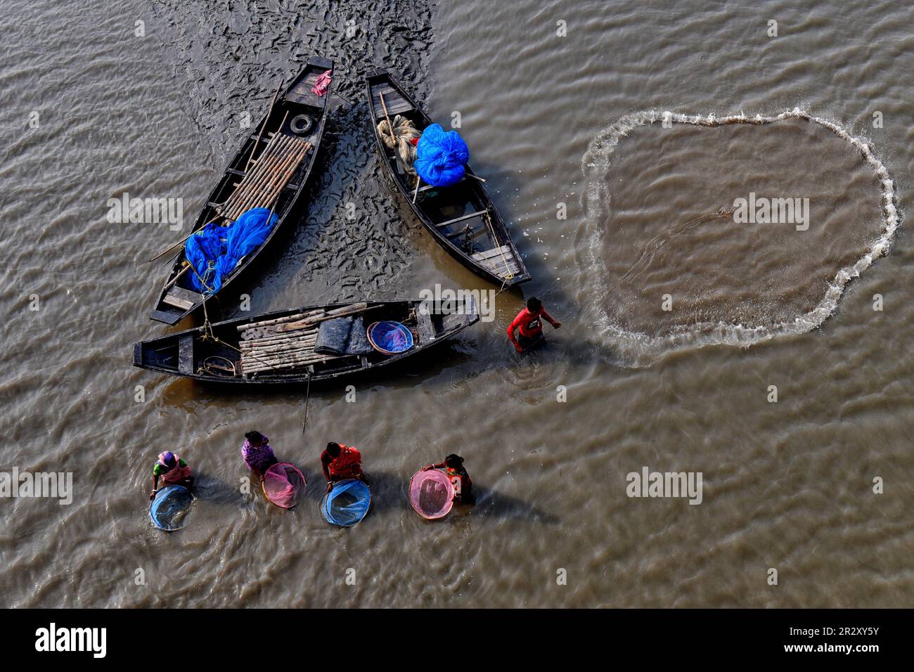 Canning, India. 21st May, 2023. Fishermen seen using colourful nets ...