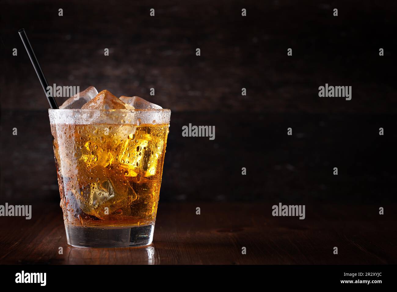 Glass of scotch whiskey and ice Stock Photo - Alamy