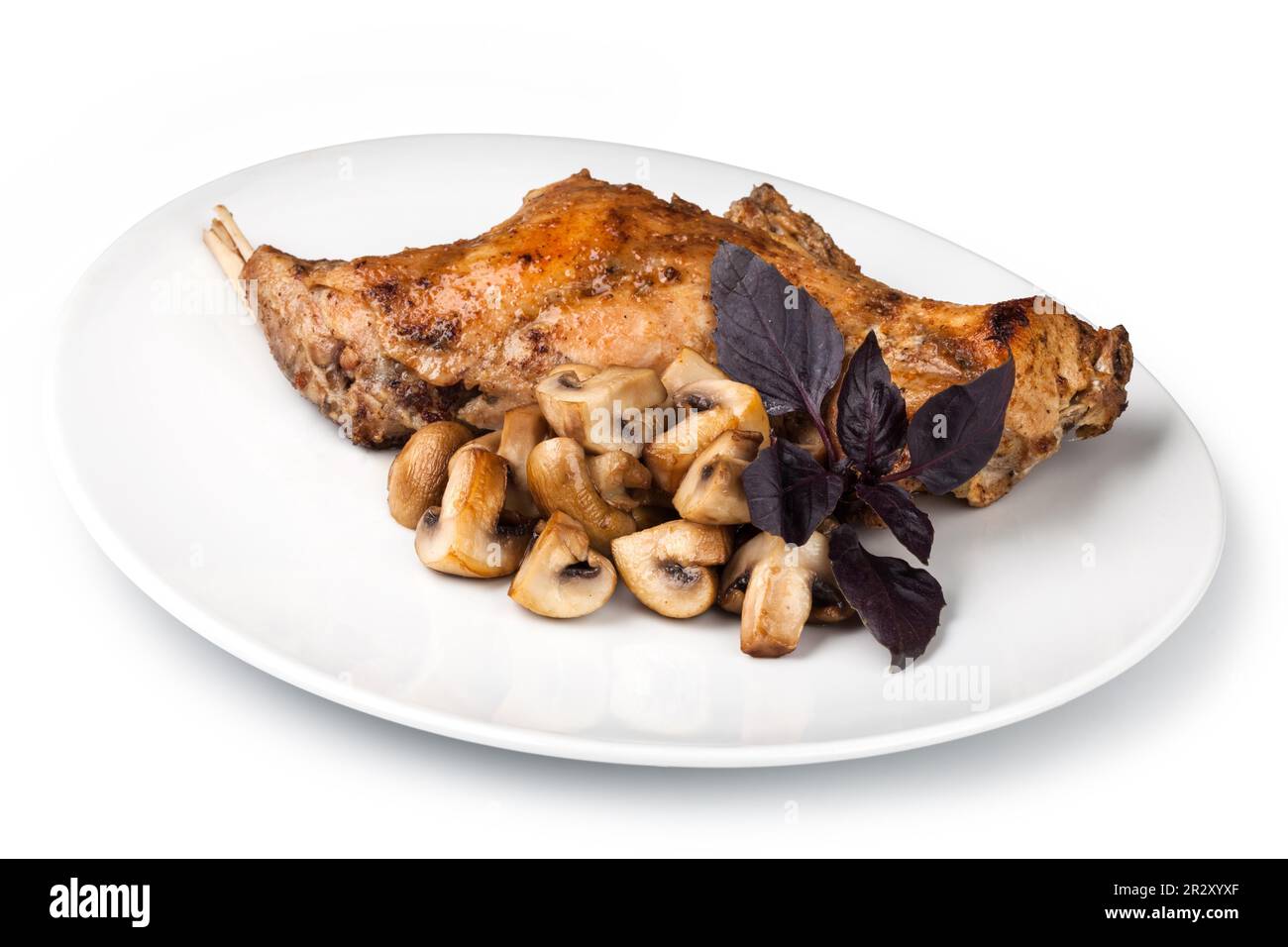 Oven Baked rabbit legs with mushroom Stock Photo - Alamy