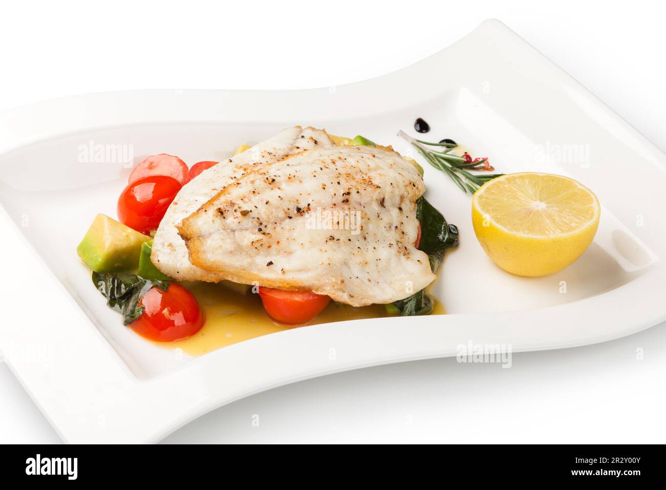 Grilled Fish Fillet on a white plate Stock Photo - Alamy