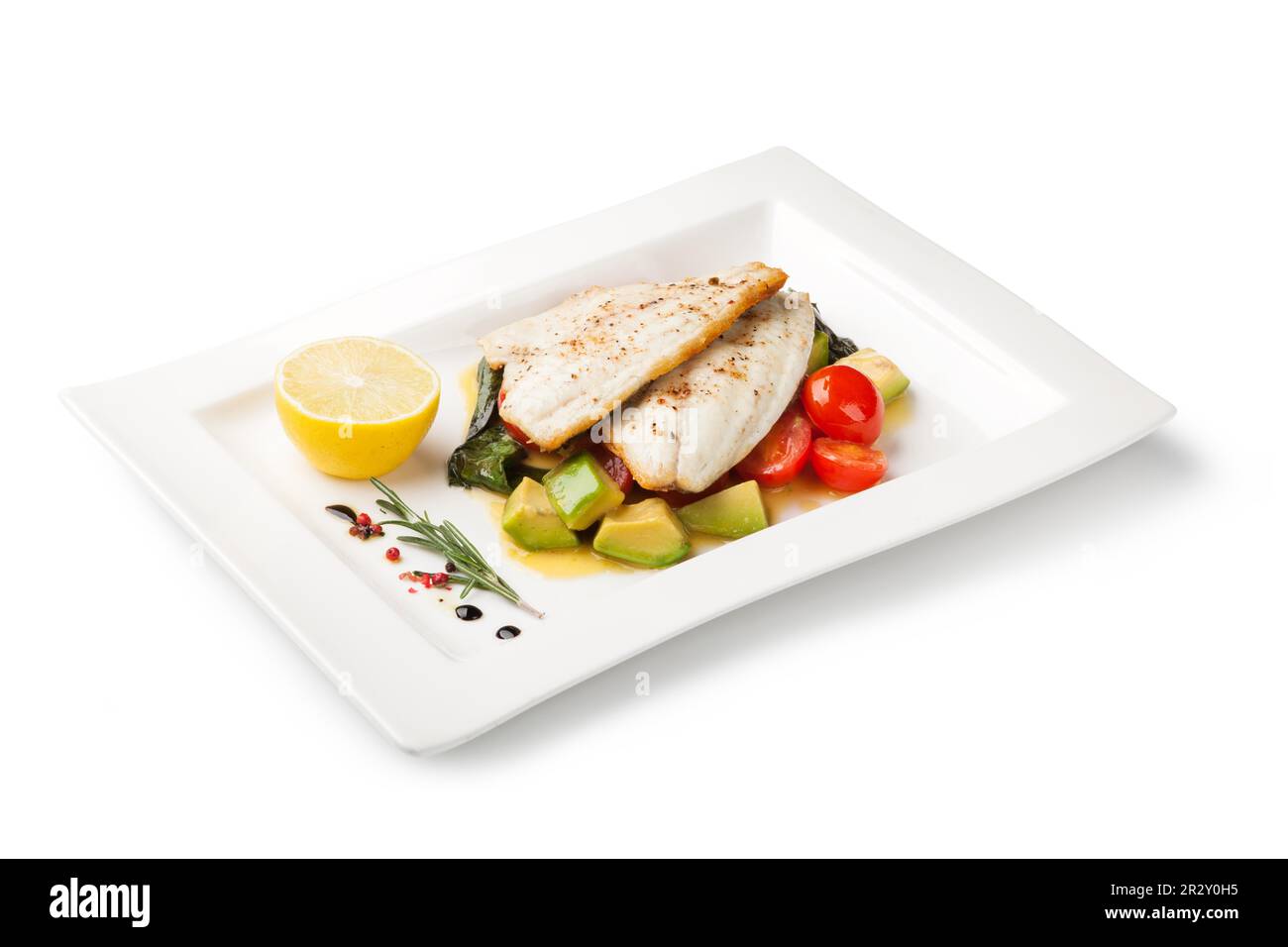 Plate roasted fish fillet Cut Out Stock Images & Pictures - Alamy
