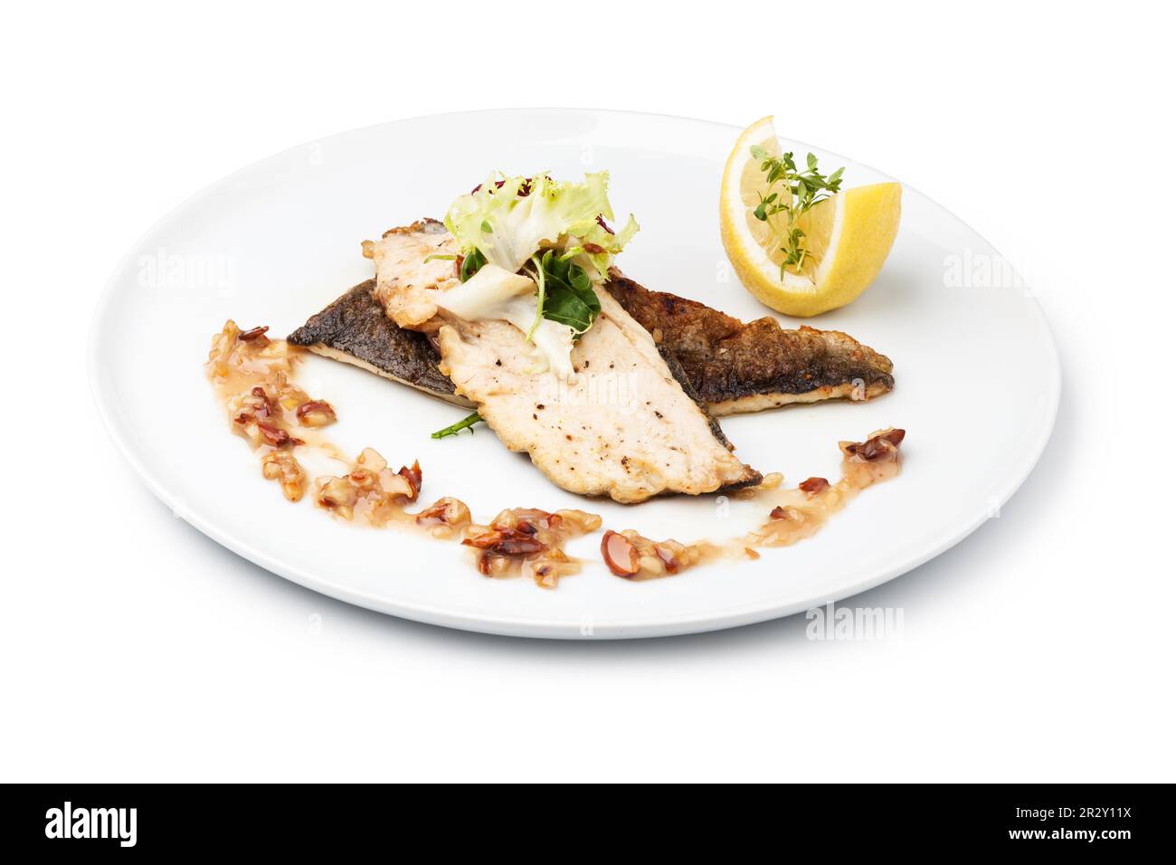 Grilled Fish Fillet on a white plate Stock Photo - Alamy