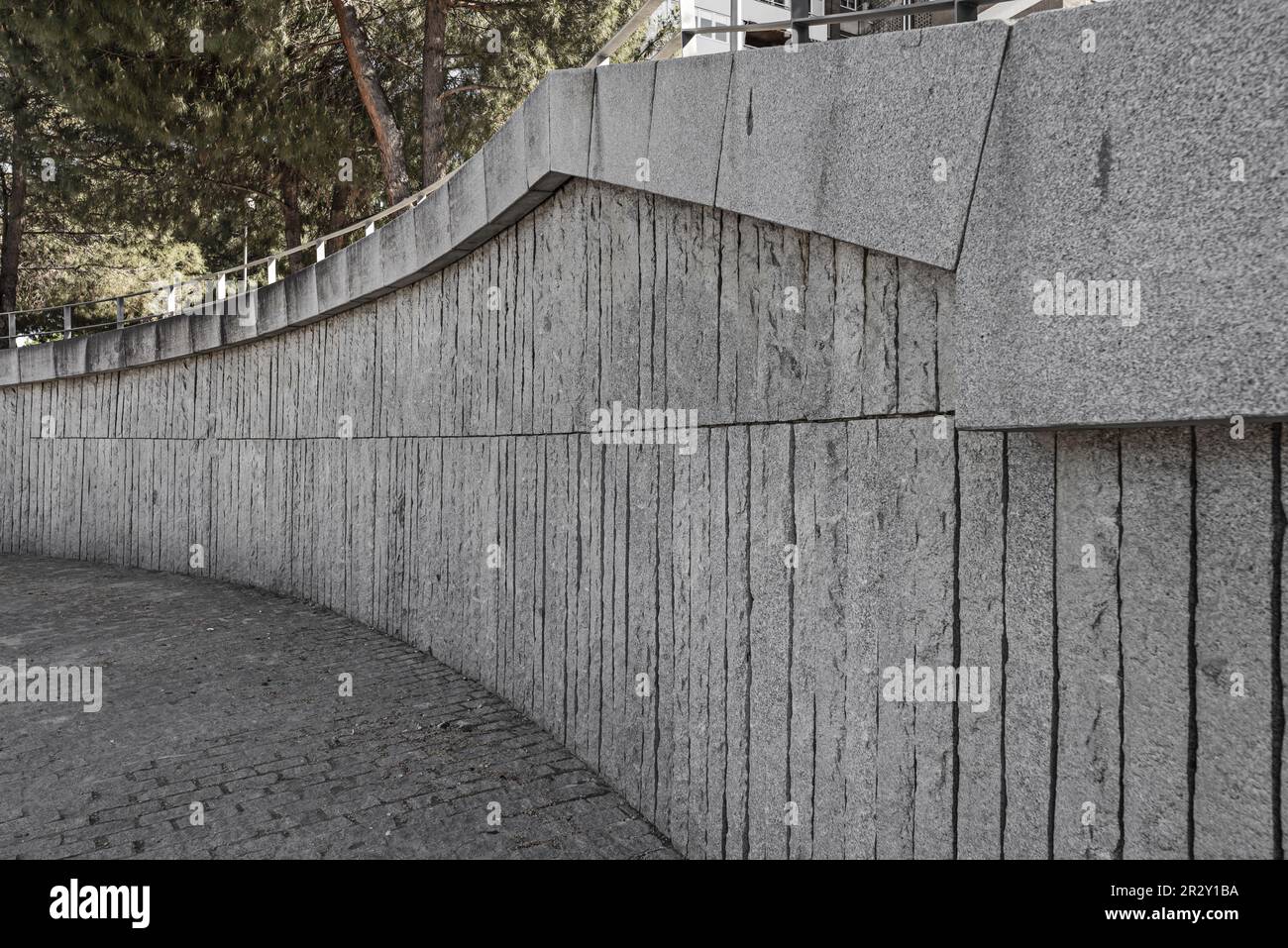 Gray granite wall with strips of stone and paving stone floors of the same material Stock Photo ...