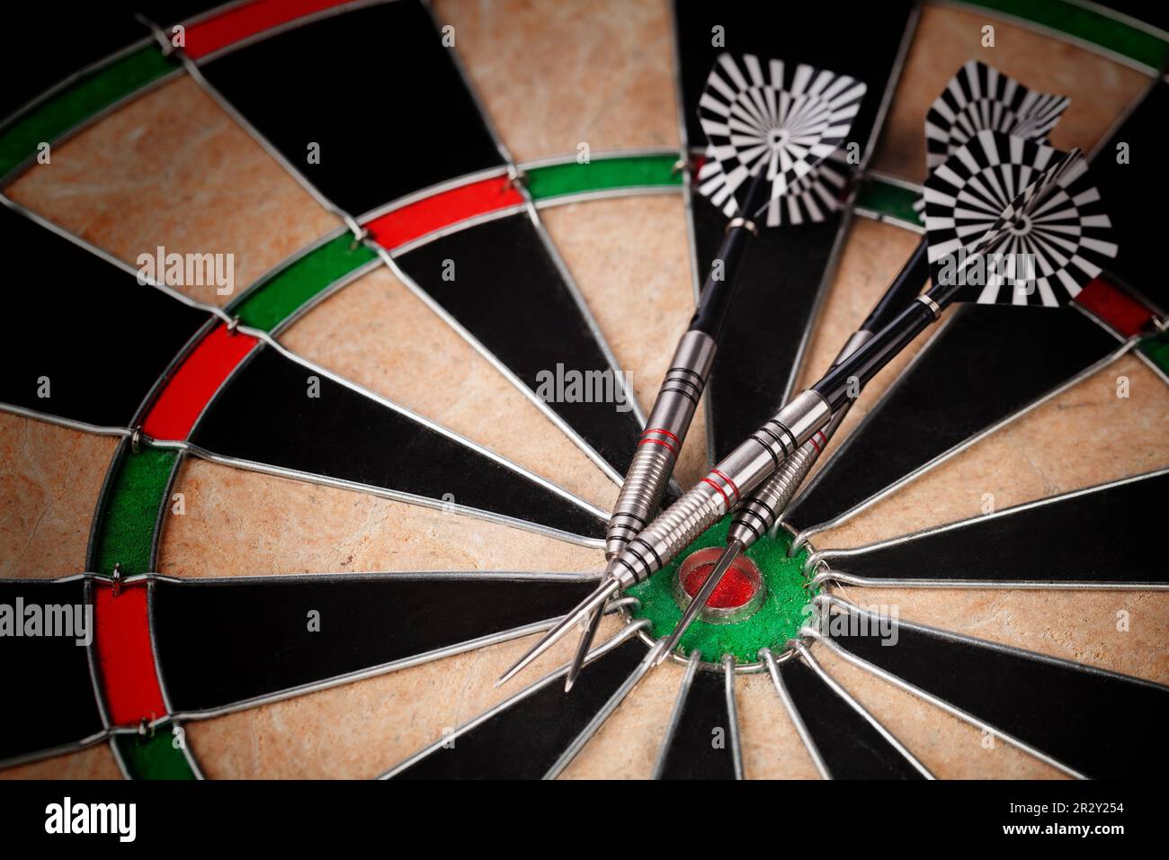 darts arrows on the target Stock Photo - Alamy
