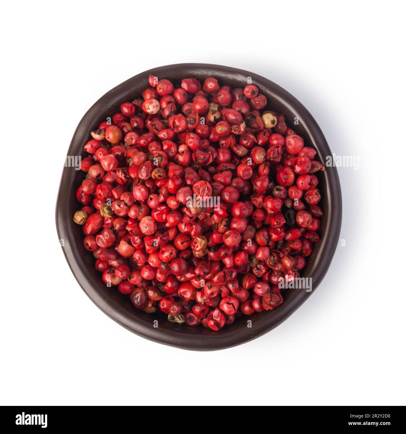 pink pepper on white background Stock Photo - Alamy