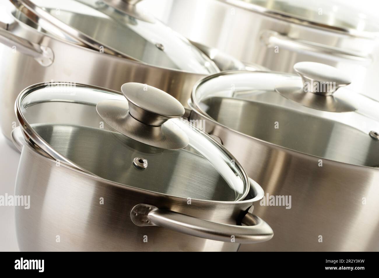 Composition with stainless pots Stock Photo - Alamy
