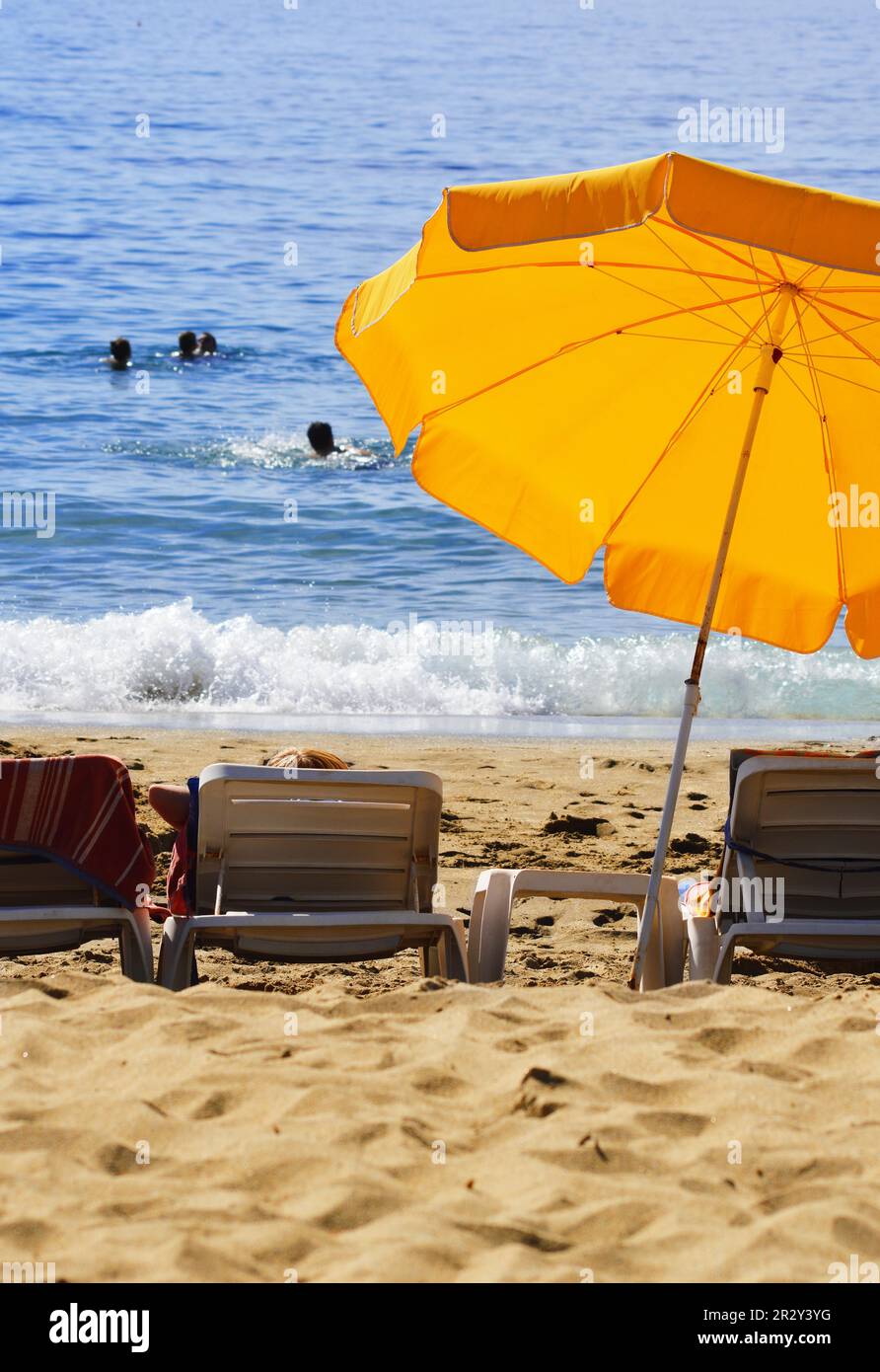Mediterranean beach during hot summer day Stock Photo - Alamy