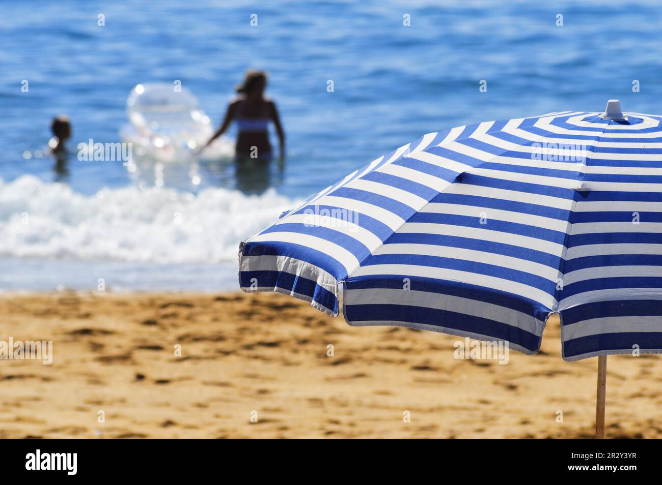 Mediterranean beach during hot summer day Stock Photo - Alamy