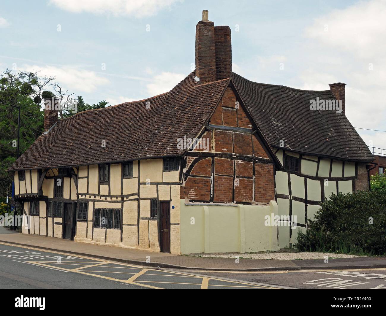 ancient wonky timbered buildings with tall chimneys leaded-light ...