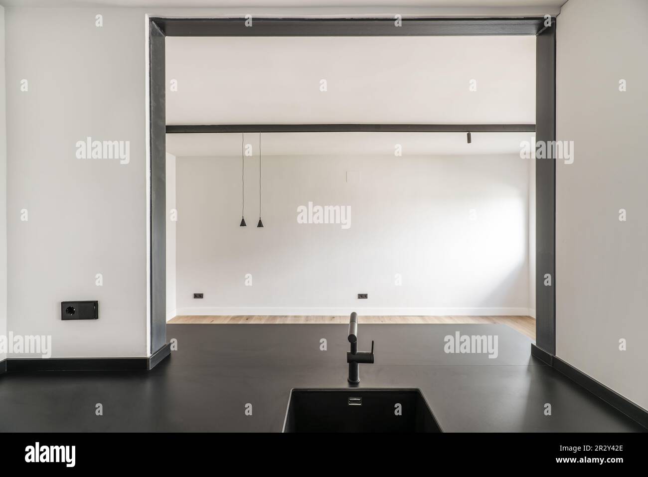 fitted kitchen with serving hatch and sink with black faucet, large ...