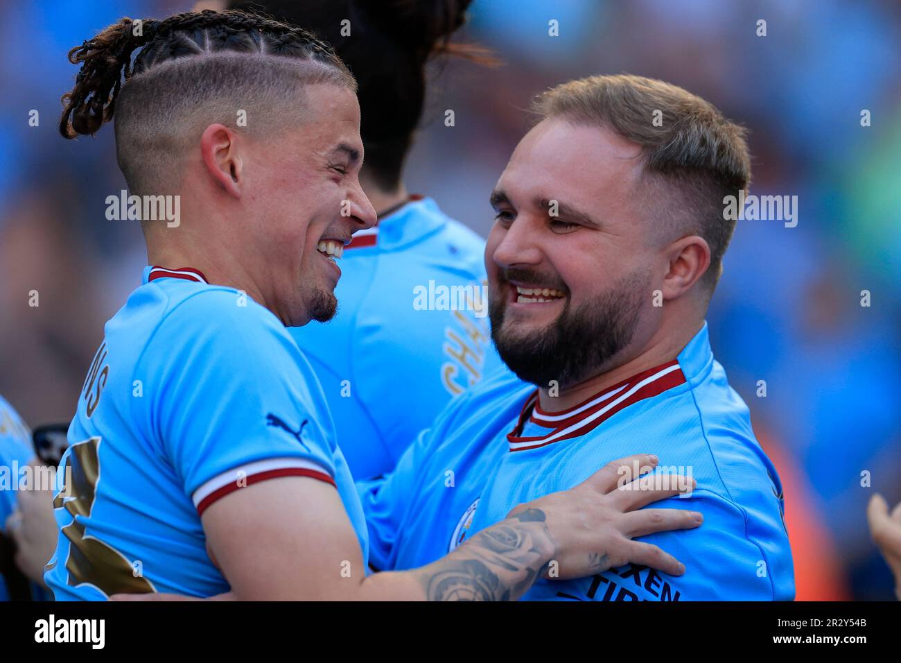 Kalvin Phillips #4 of Manchester City with a staff member as he walks ...