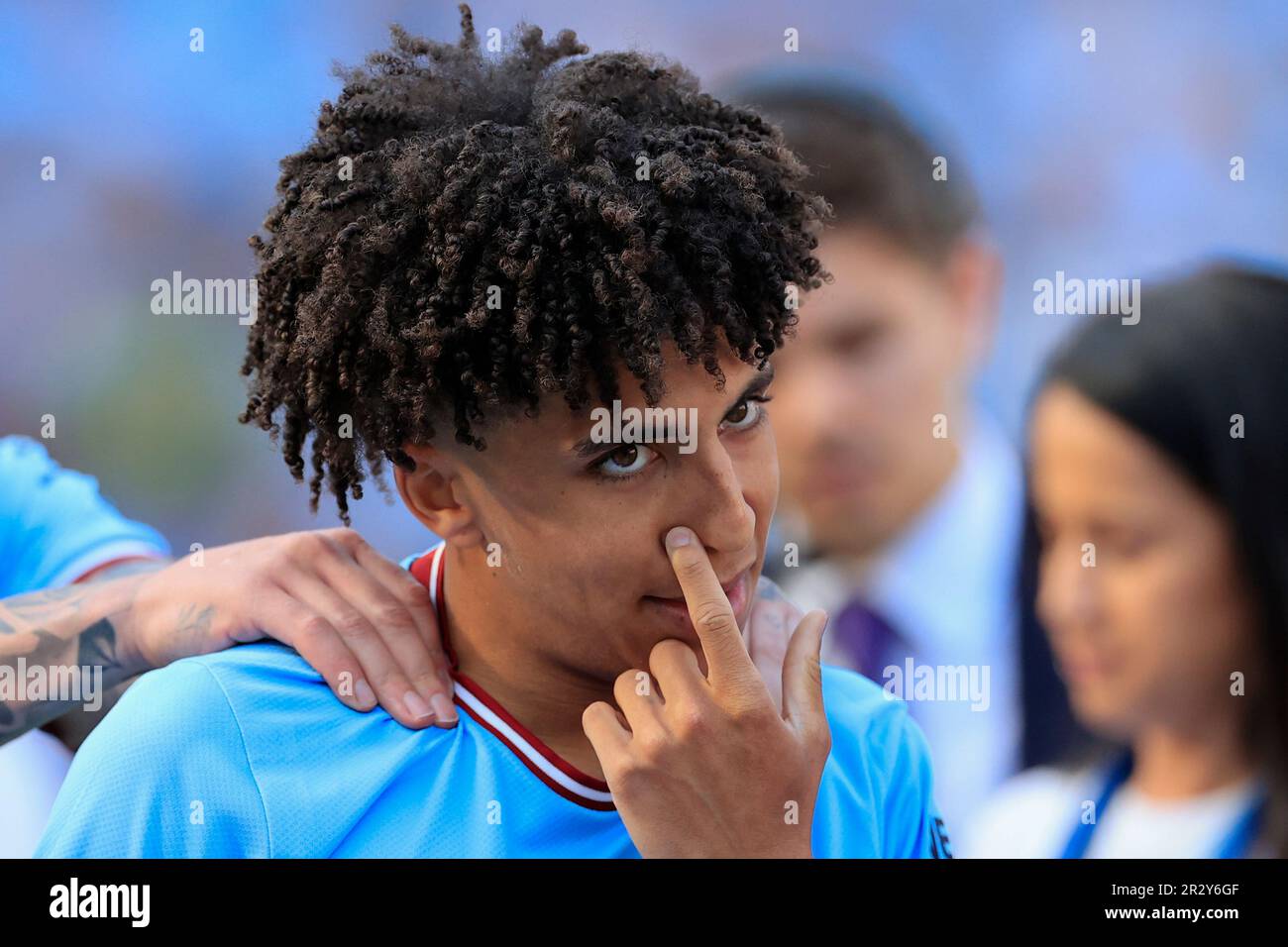 Rico Lewis #82 of Manchester City walks to the presentation podium ...