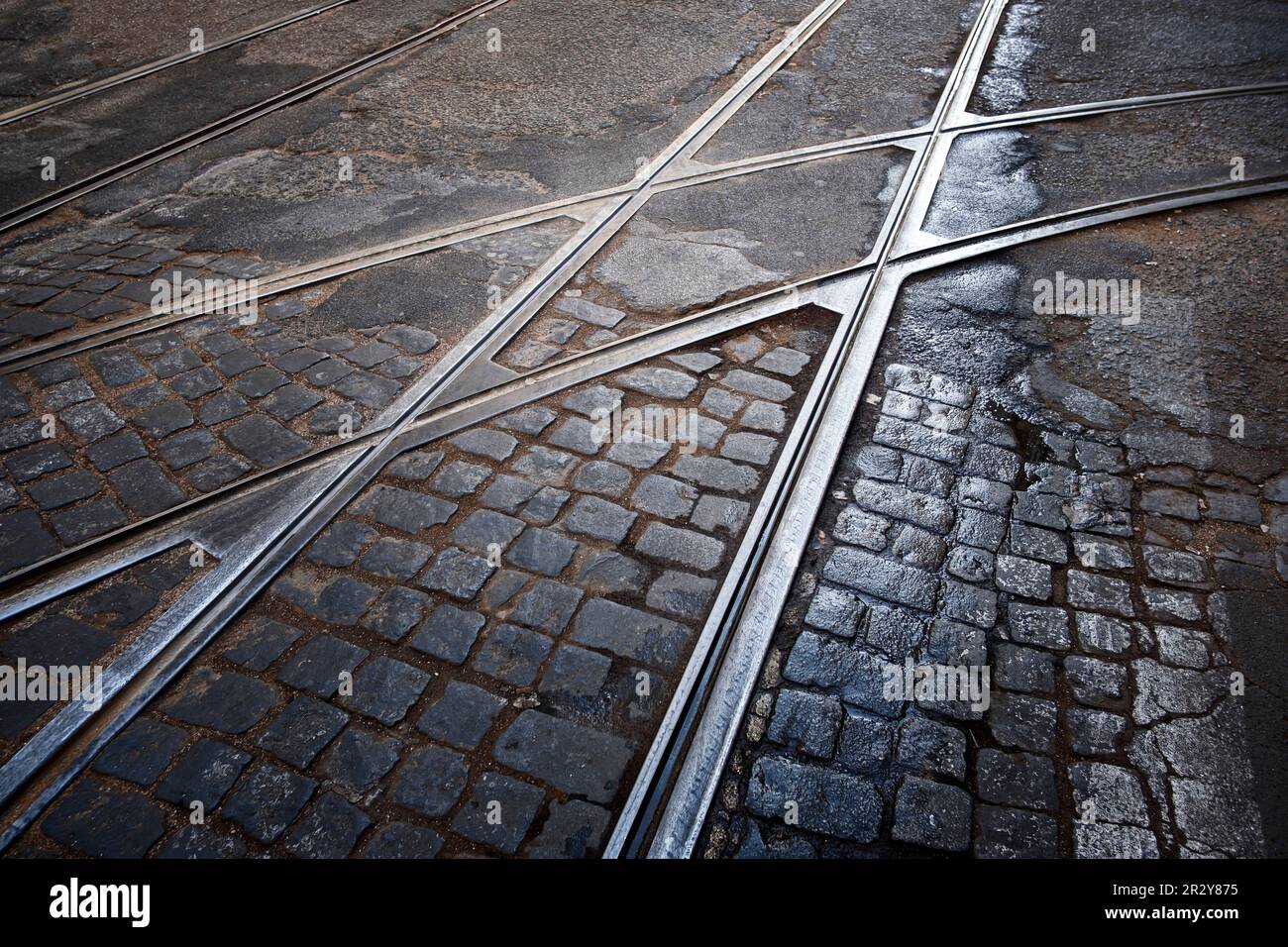 tramway railway crossing on a cobblestone street in lisbon Portugal ...
