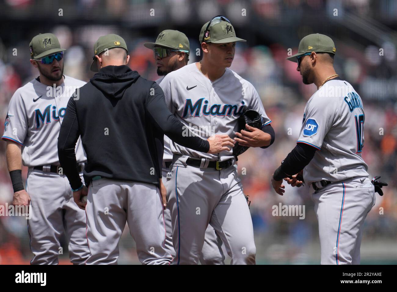 Miami Marlins pitcher Jesus Luzardo, middle, walks to the dugout after ...