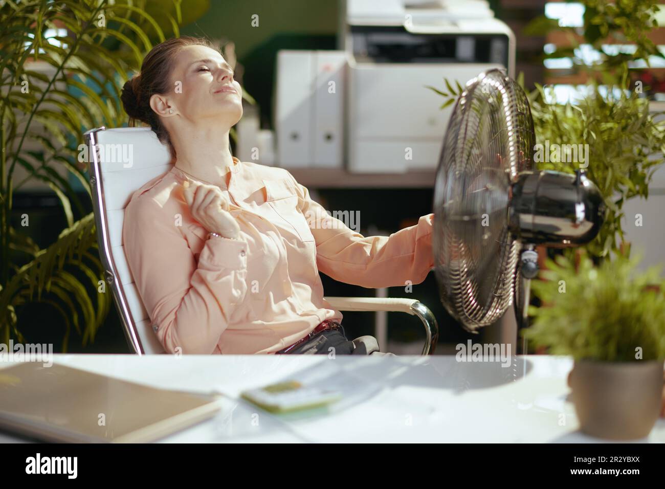 Sustainable workplace. relaxed modern small business owner woman at ...