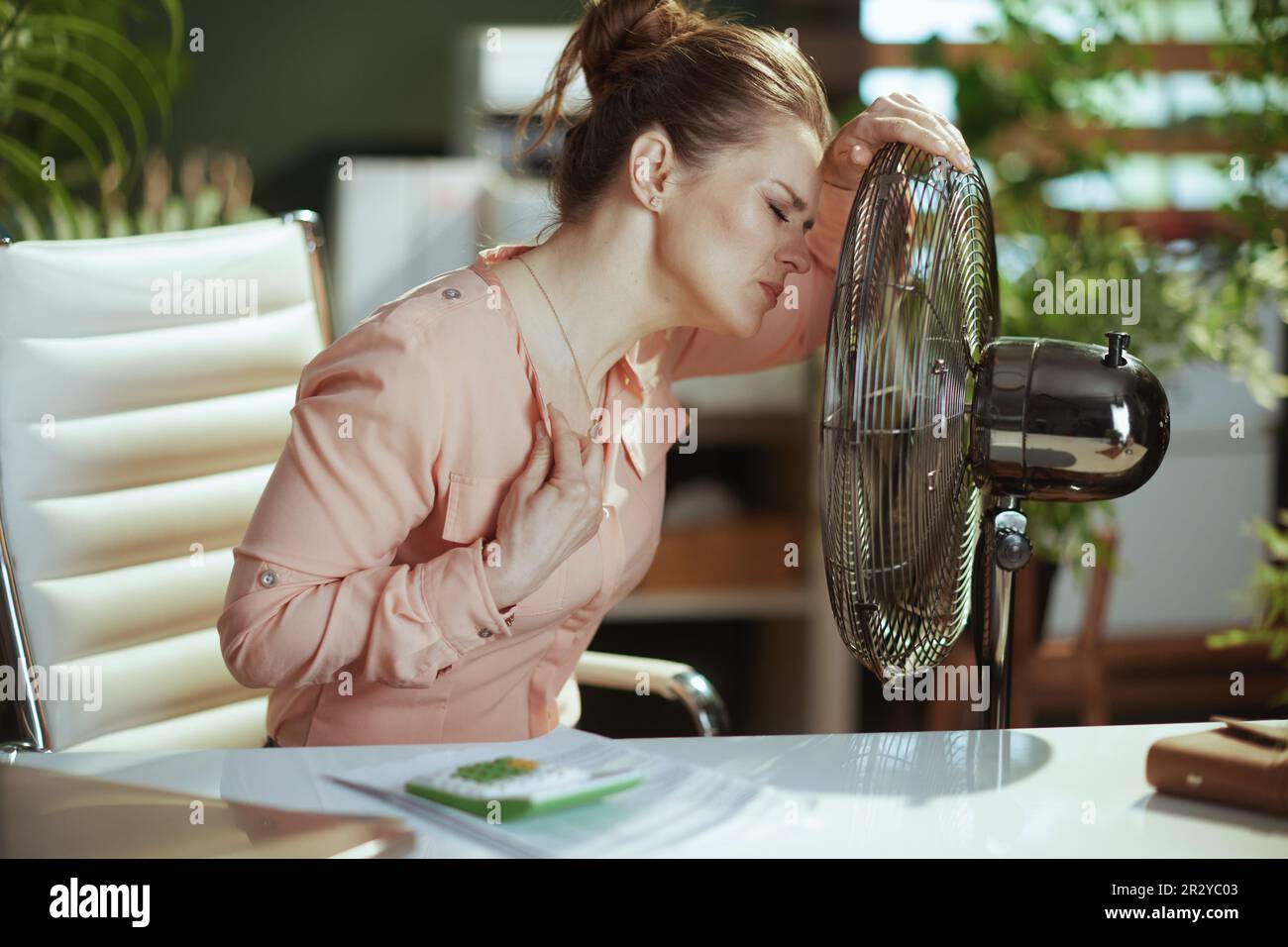 Sustainable workplace. modern 40 years old woman worker at work with ...