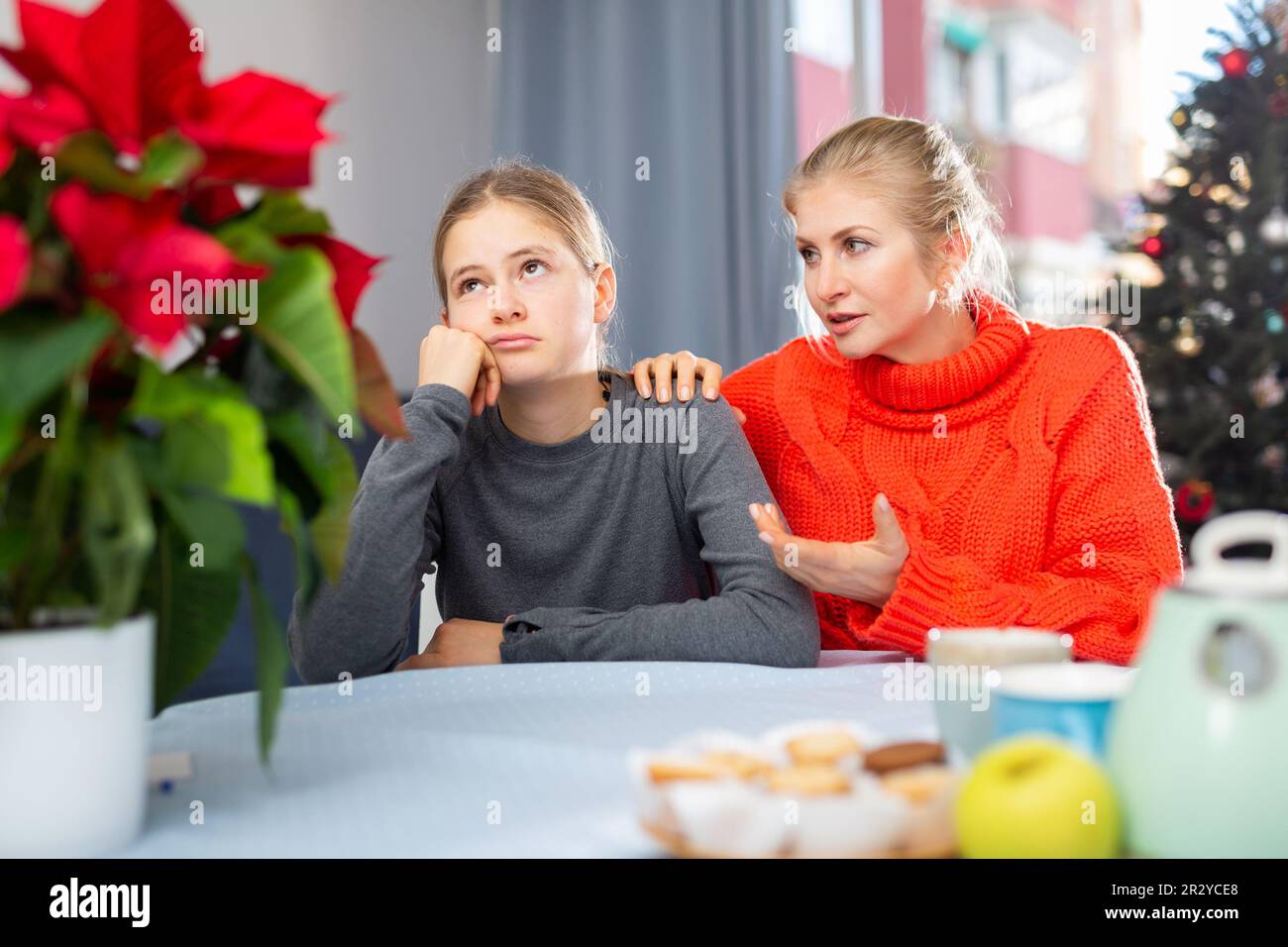 Teenage girl ignoring her mother before Christmas Stock Photo - Alamy