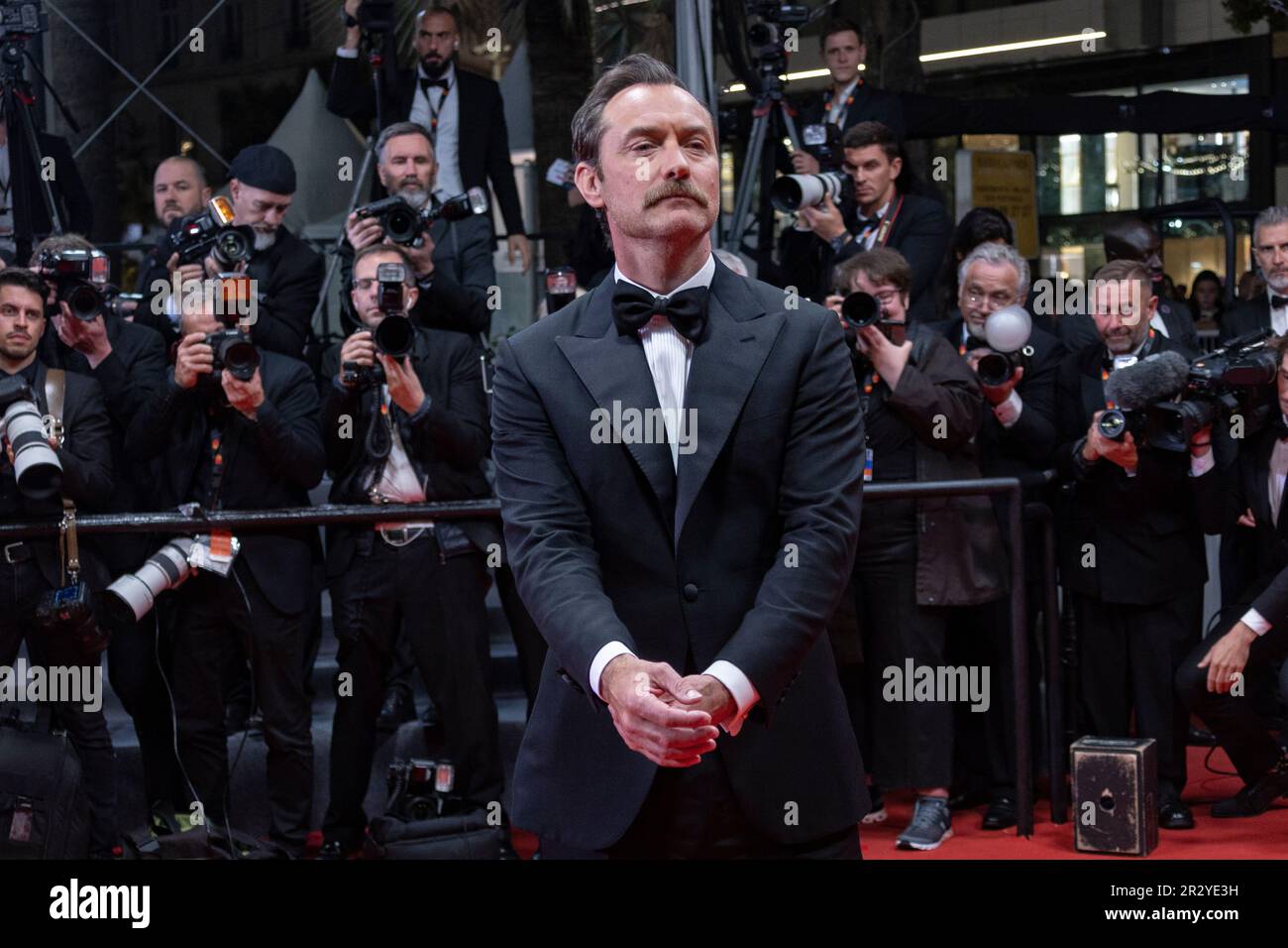 Jude Law poses for photographers upon departure from the premiere of ...