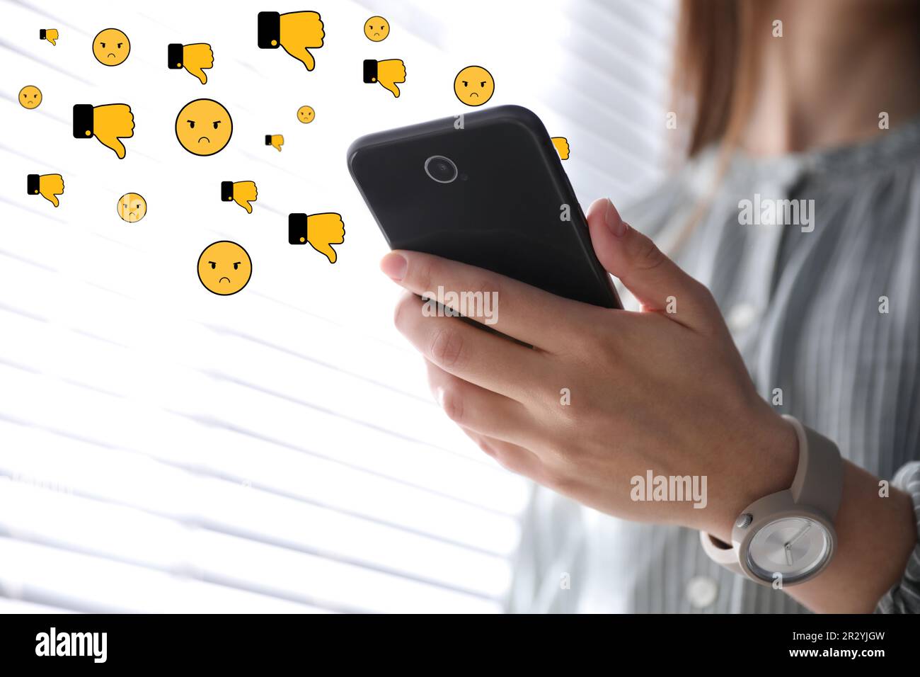 Social media dislike reaction. Woman using mobile phone indoors ...