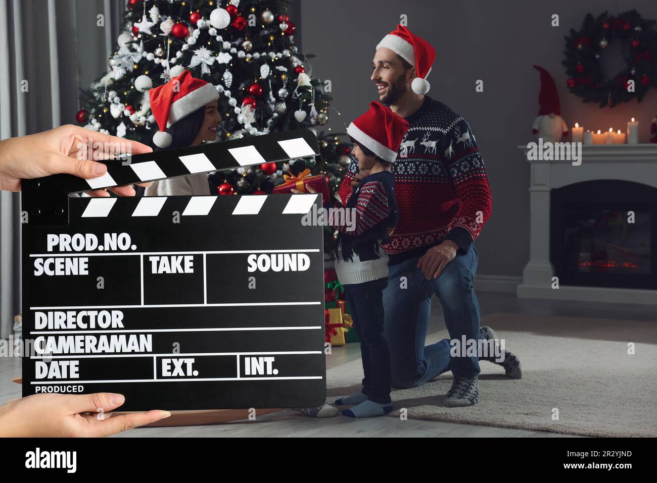 Shooting movie. Second assistant camera holding clapperboard in front ...