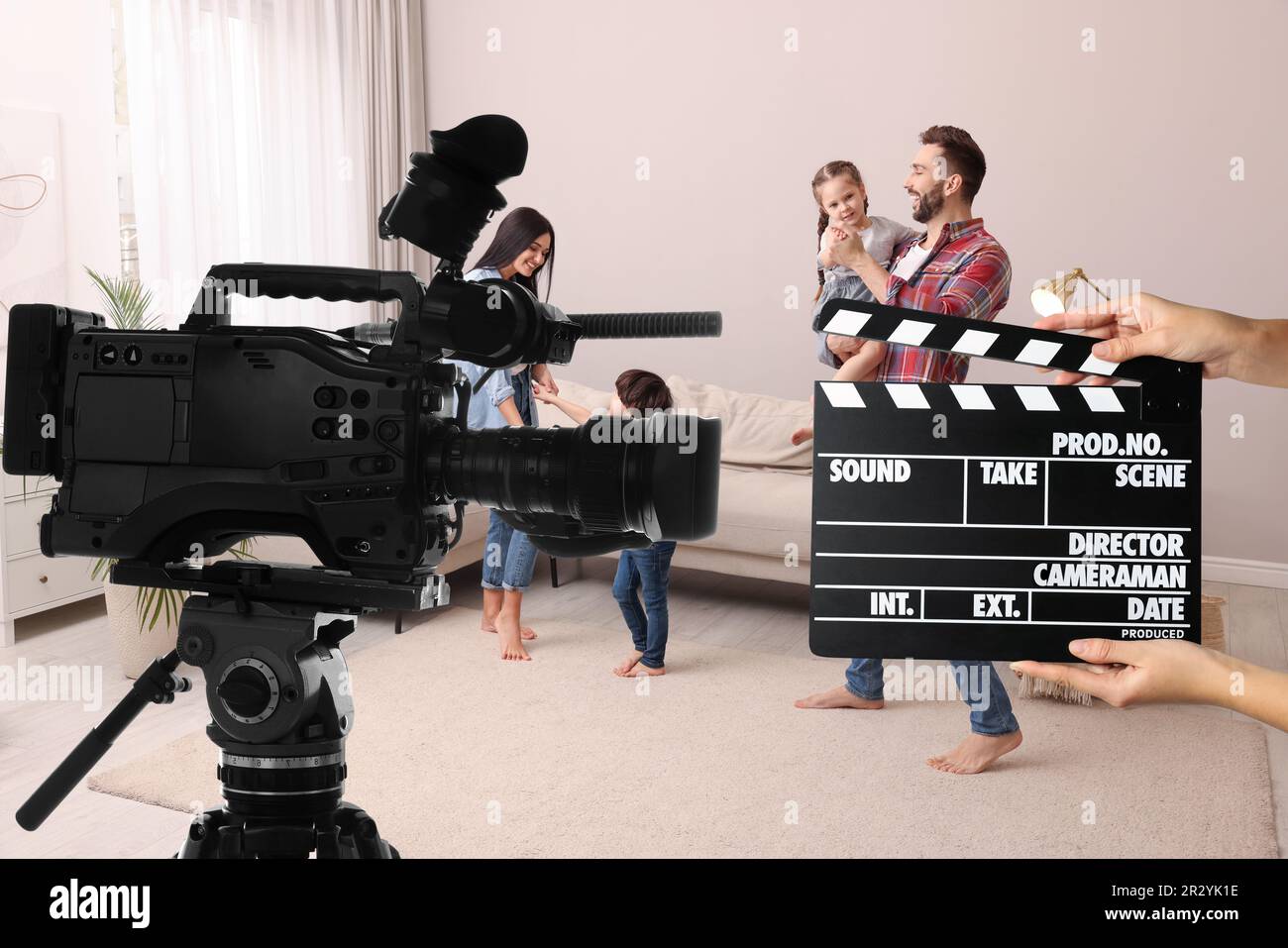 Shooting movie. Second assistant camera holding clapperboard near video ...