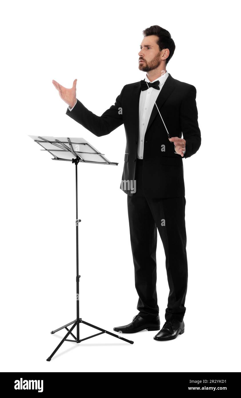 Professional conductor with baton and note stand on white background ...