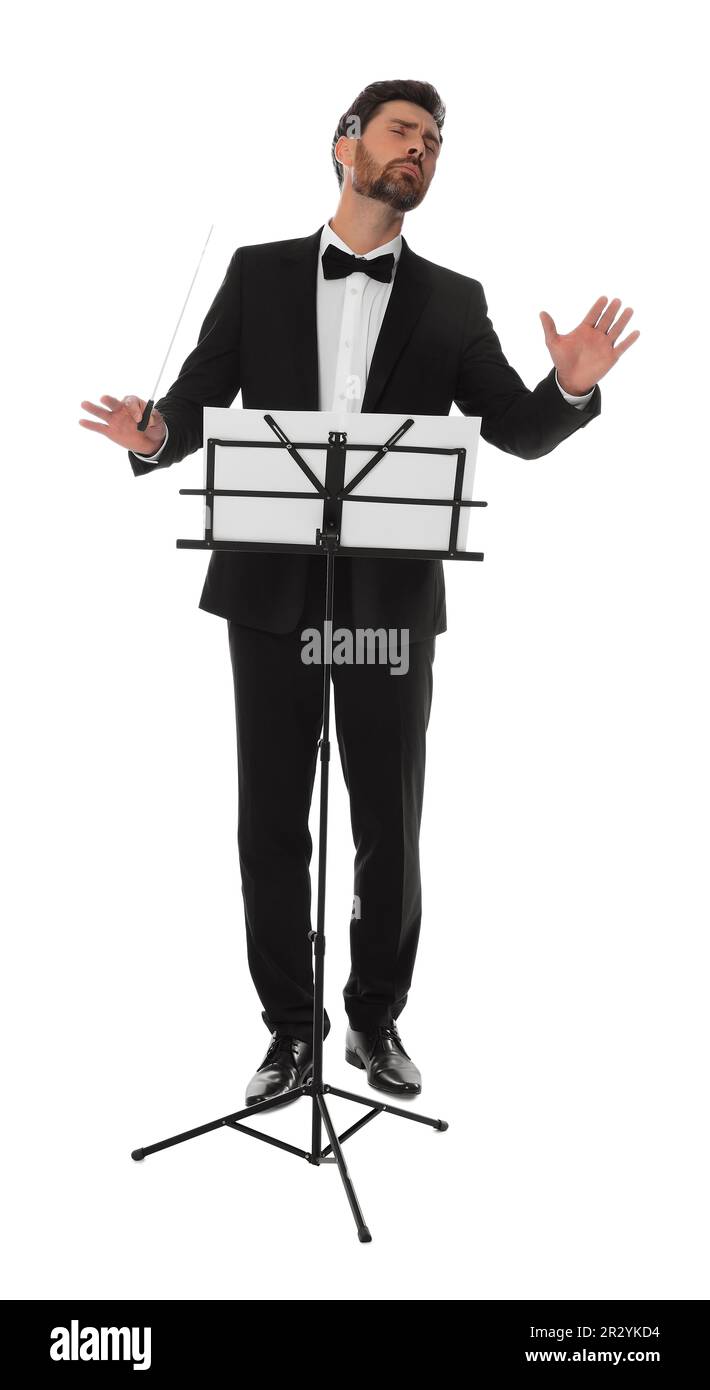 Professional conductor with baton and note stand on white background ...