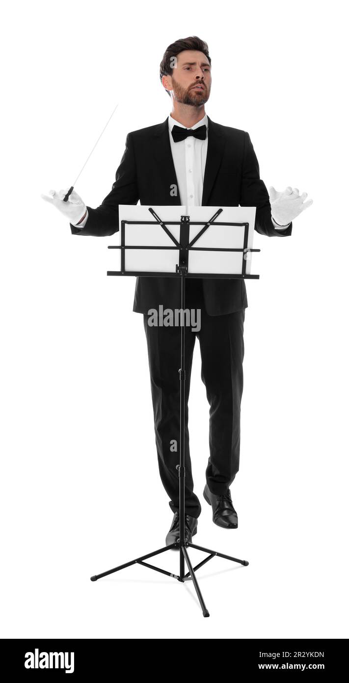 Professional conductor with baton and note stand on white background ...