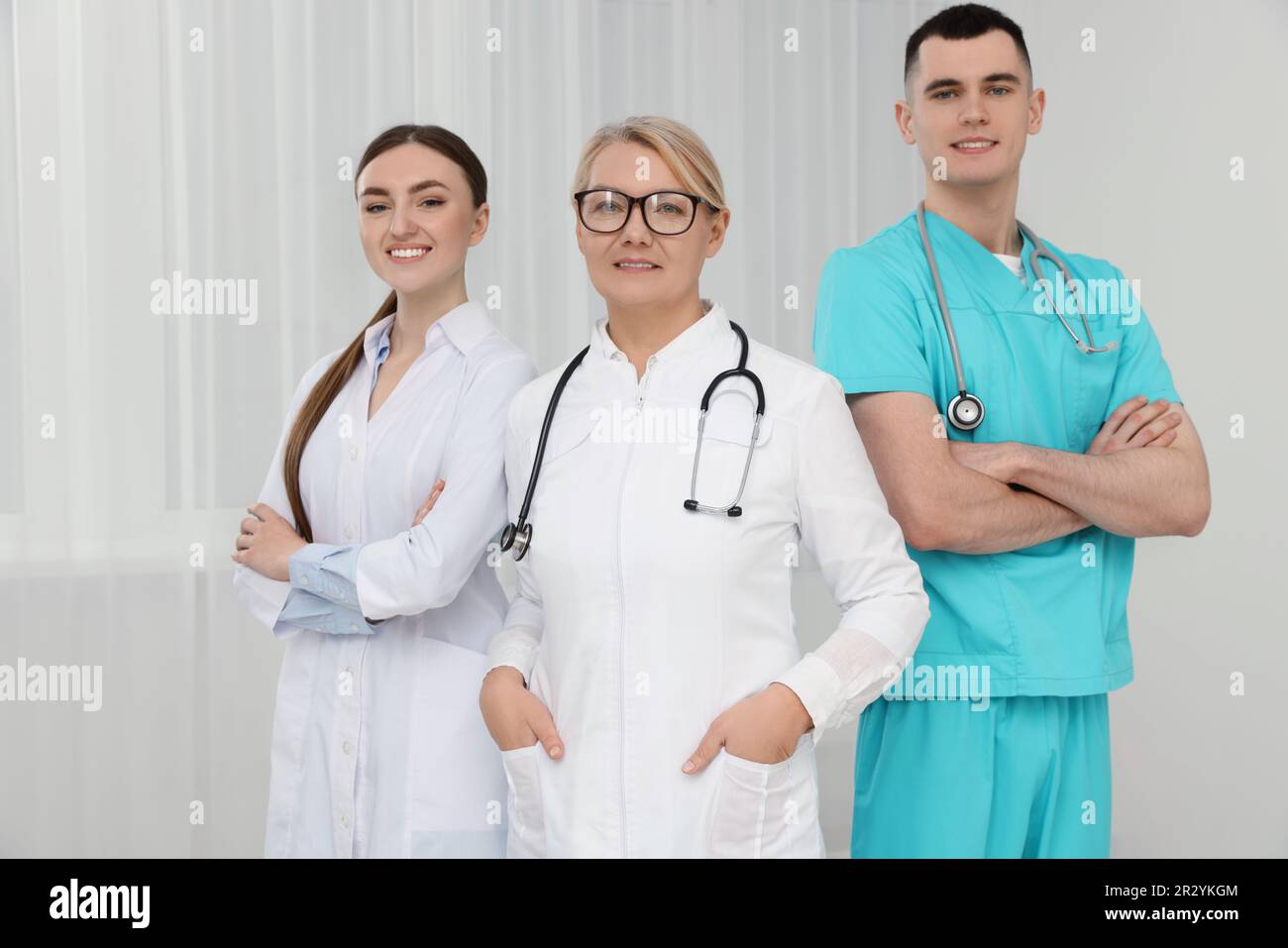 Portrait of medical doctors wearing uniforms indoors Stock Photo - Alamy