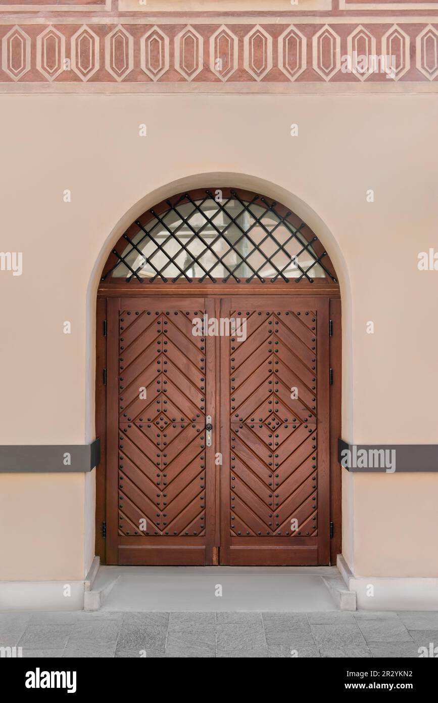 Entrance of building with brown wooden door Stock Photo - Alamy