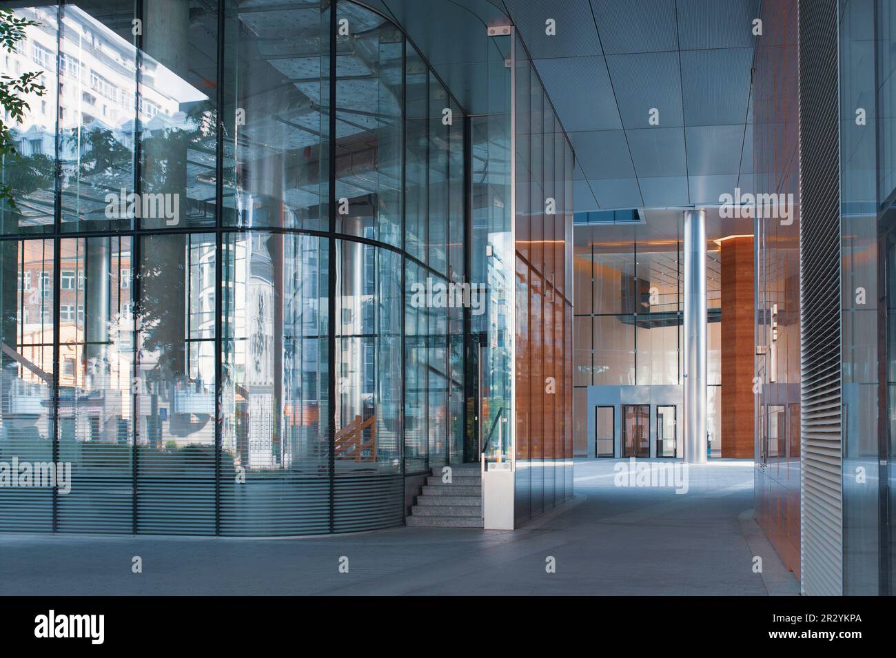 Modern hallway interior with staircase and tall windows Stock Photo - Alamy