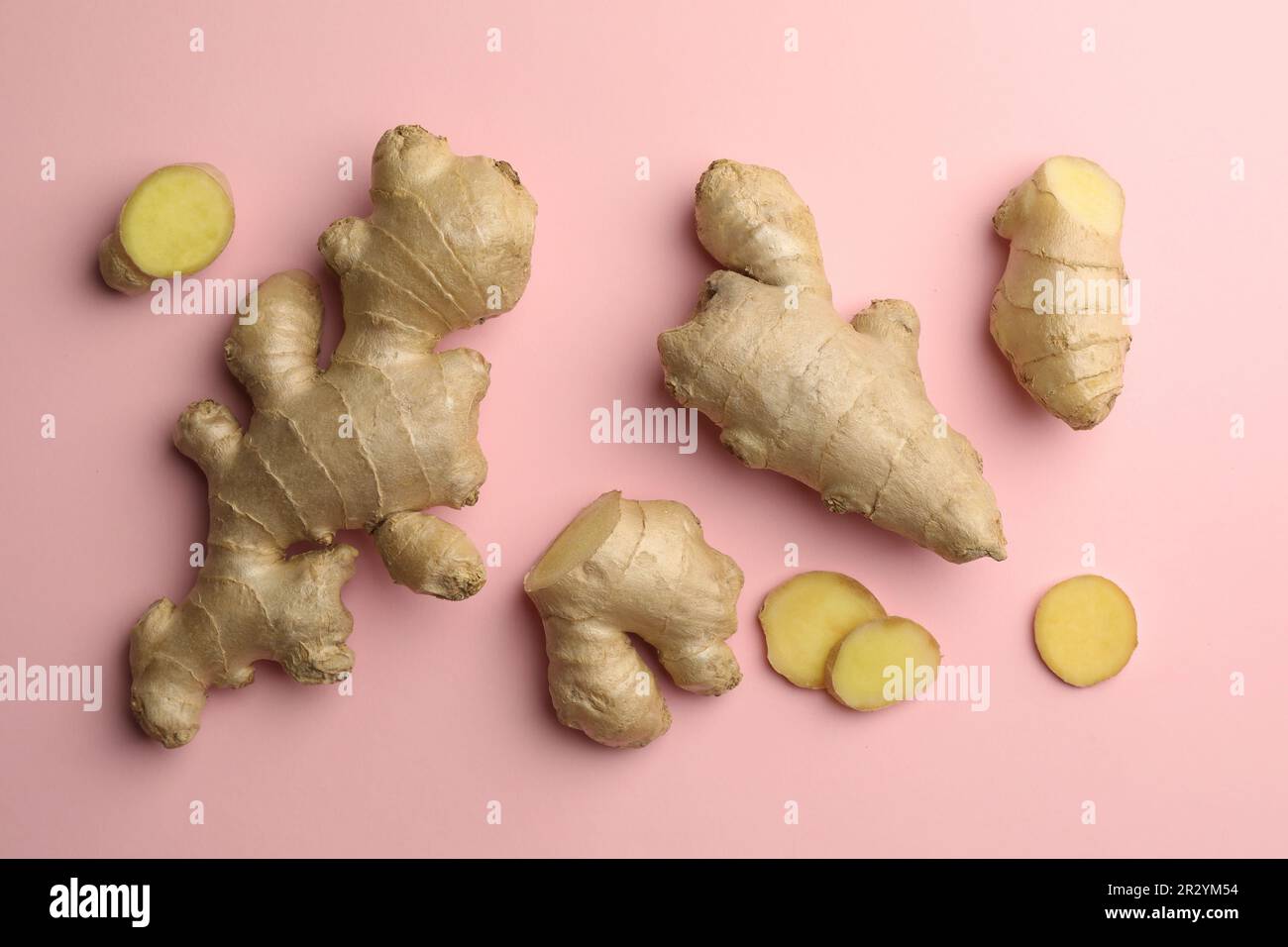 Fresh ginger on pale pink background, flat lay Stock Photo - Alamy