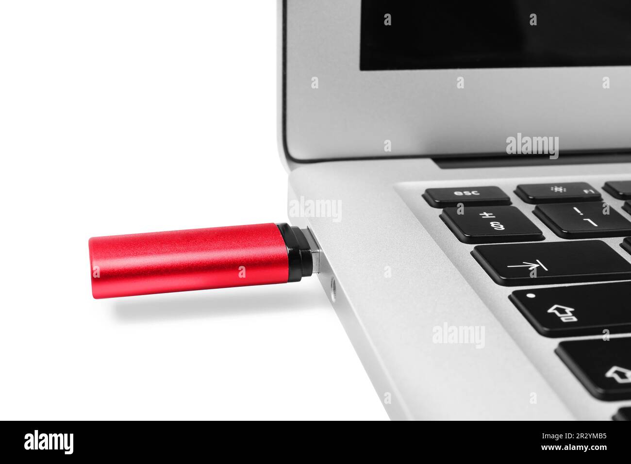 Usb flash drive attached into laptop on white background Stock Photo ...