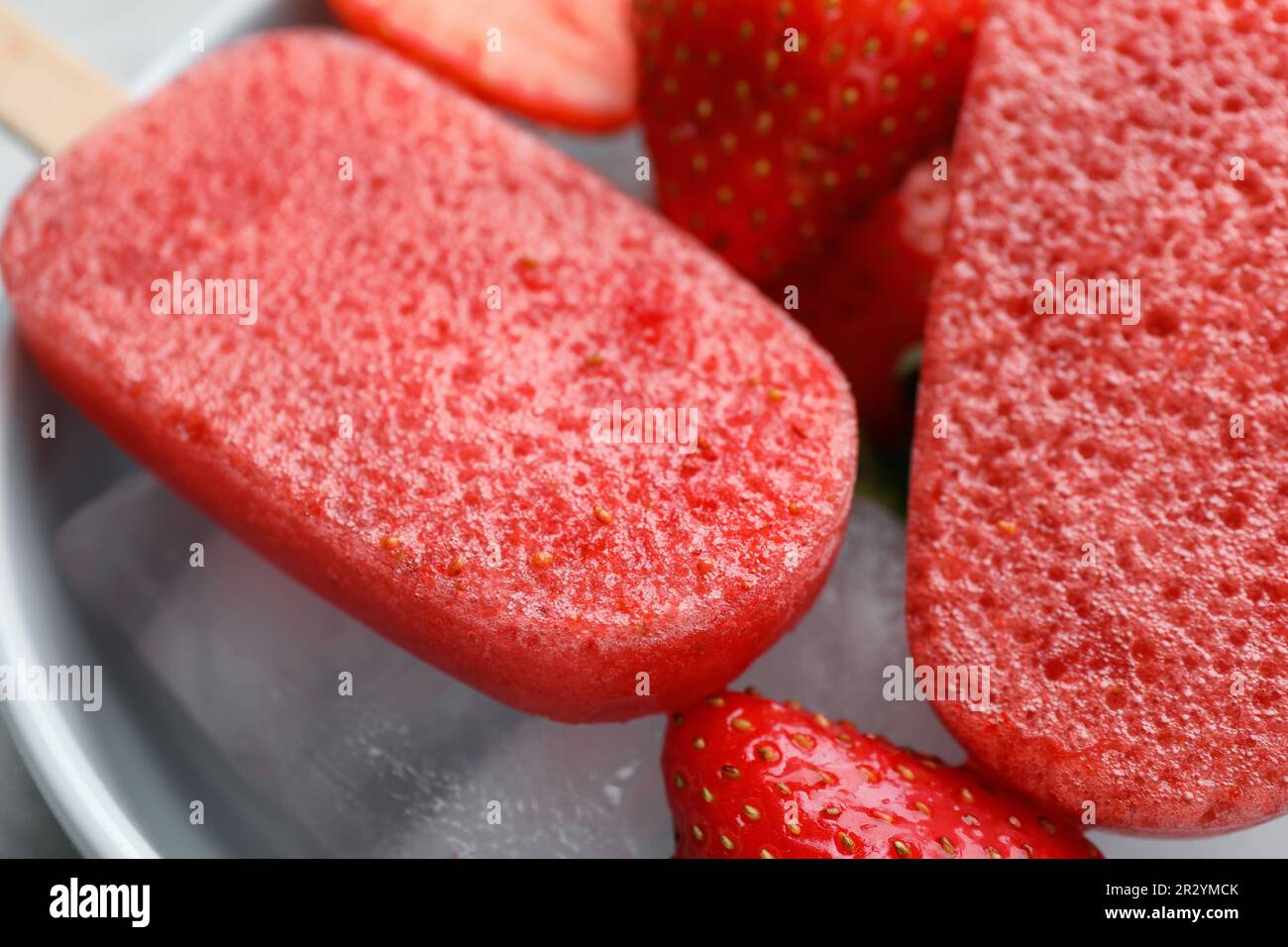 Tasty strawberry ice pops in bowl, closeup. Fruit popsicle Stock Photo ...