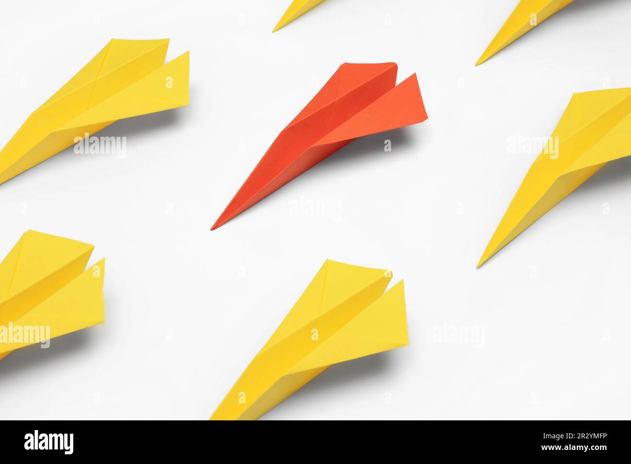 Handmade colorful paper planes on white table. Uniqueness concept Stock ...