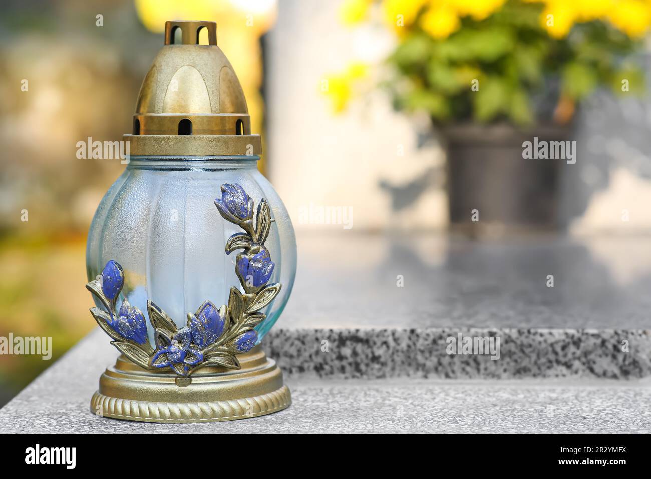 Grave lantern on granite surface in cemetery, space for text Stock Photo - Alamy