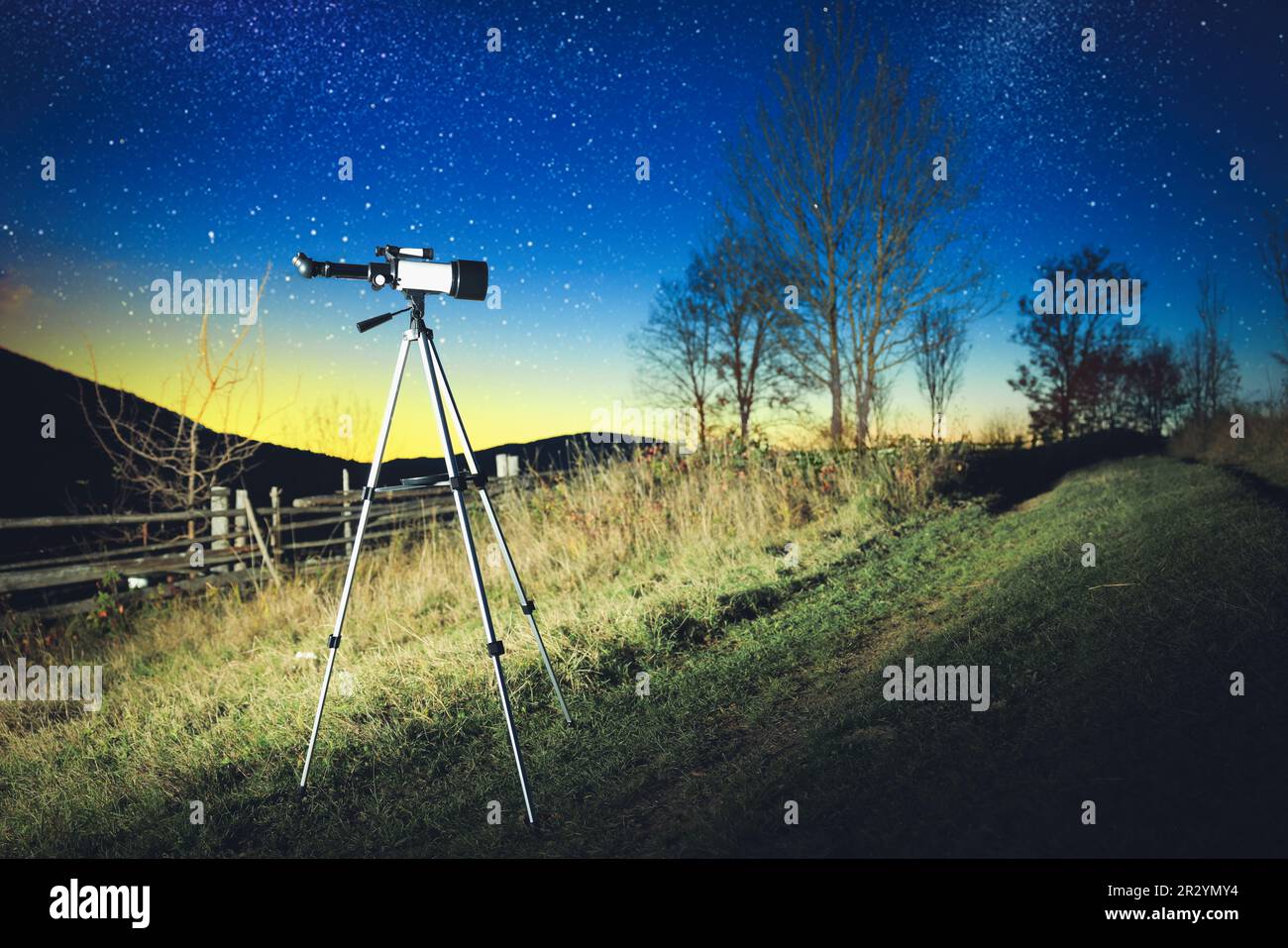Modern telescope and beautiful sky in evening outdoors. Learning ...