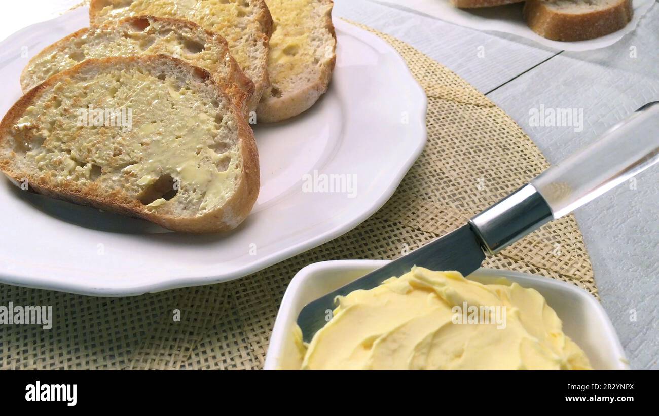 Breakfast table with bread toast with butter and milk with coffee Stock ...